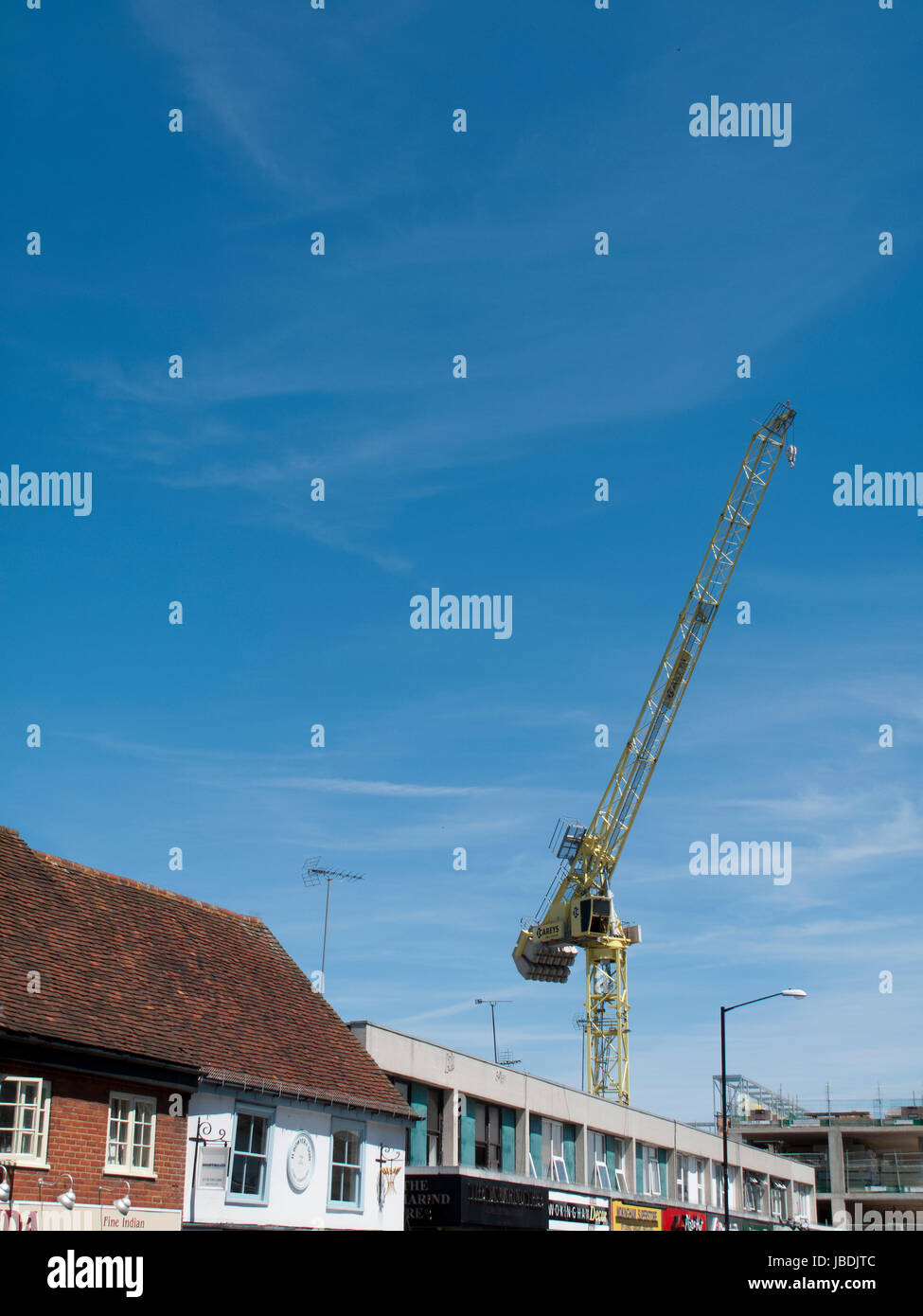 Construction site tower crane over building development Stock Photo - Alamy