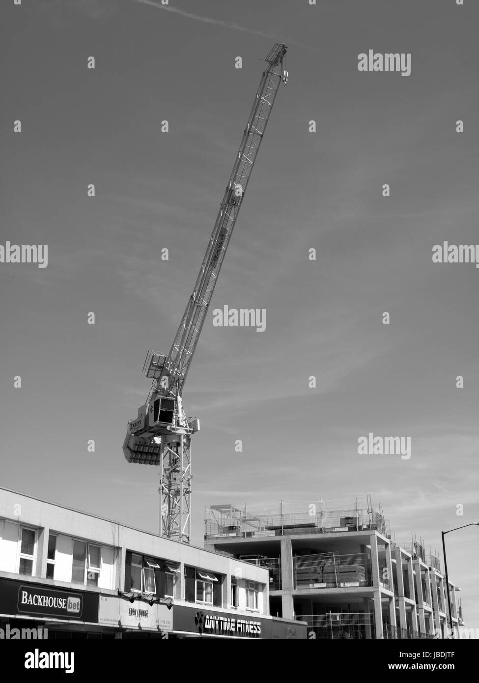 Construction site tower crane over building development Stock Photo - Alamy