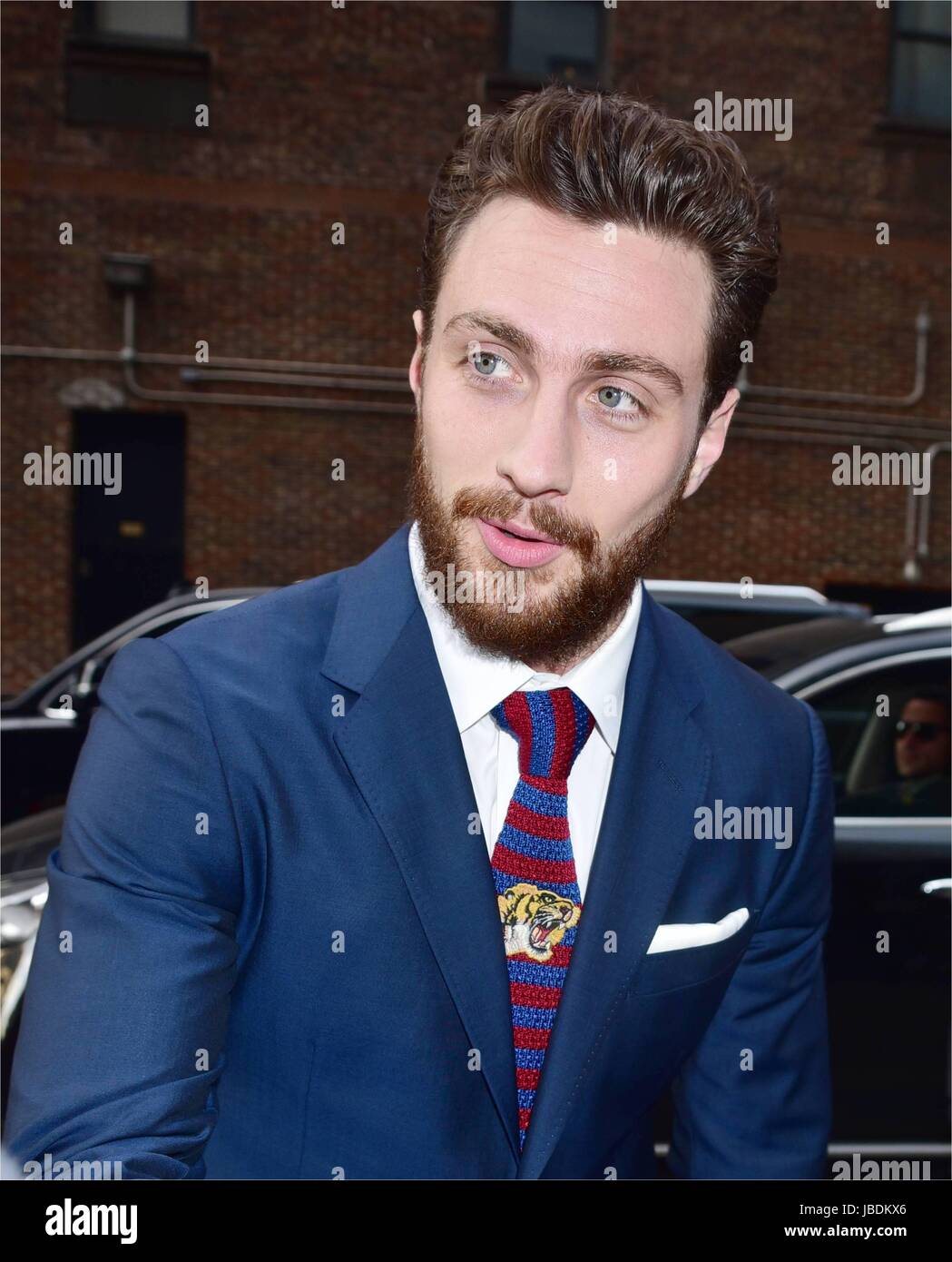 Aaron Taylor-Johnson poses for selfies and signs autographs outside ...