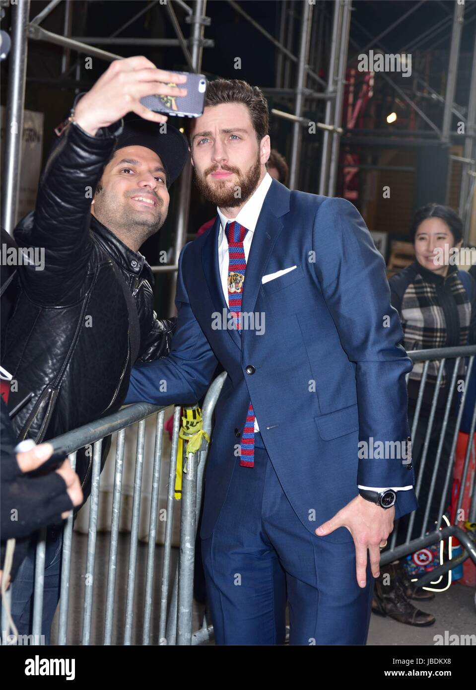 Aaron Taylor-Johnson poses for selfies and signs autographs outside ...