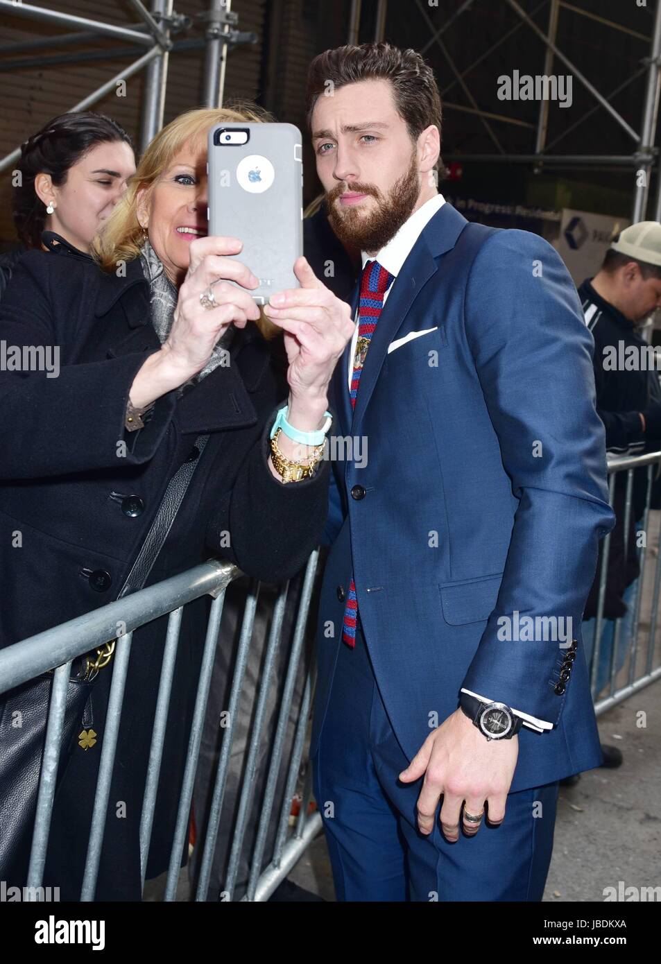Aaron Taylor-Johnson poses for selfies and signs autographs outside ...