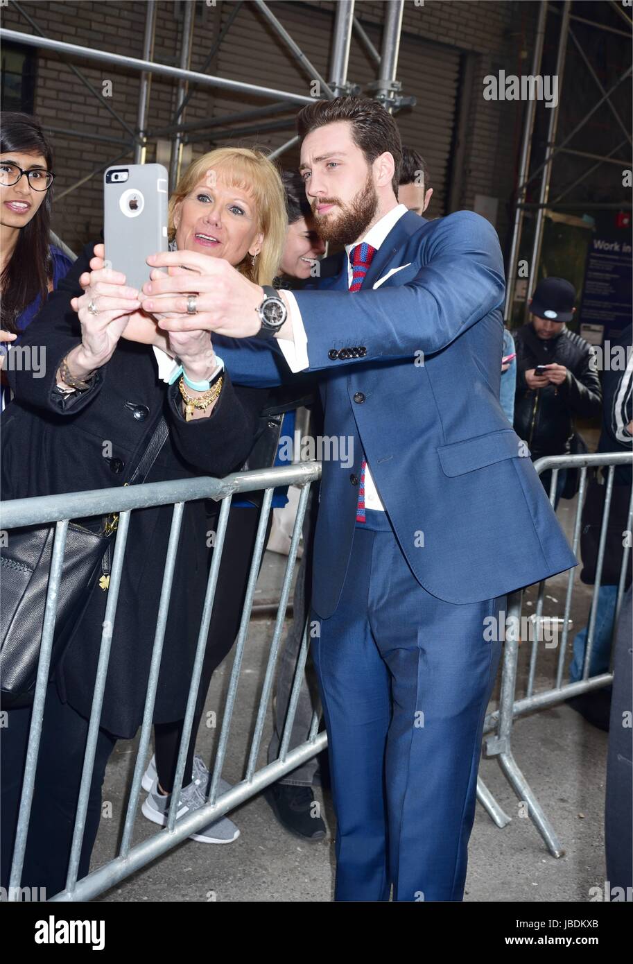 Aaron Taylor-Johnson poses for selfies and signs autographs outside ...