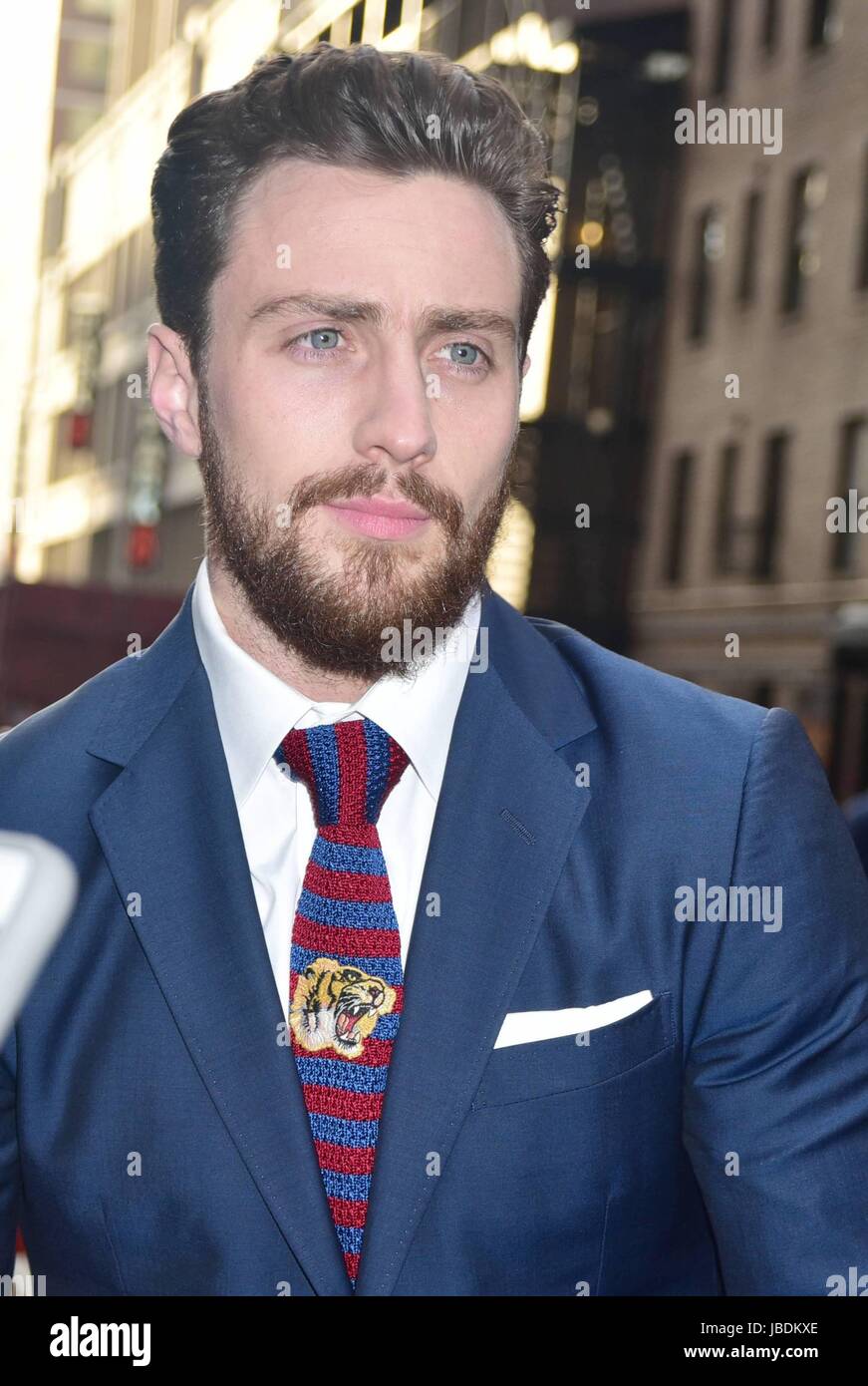 Aaron Taylor-Johnson poses for selfies and signs autographs outside ...