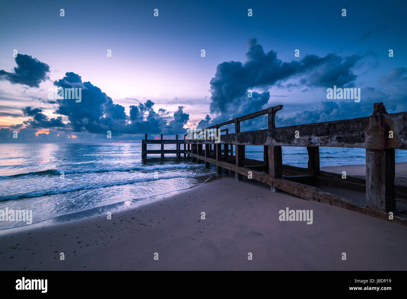Concrete jetty along side to the sea Stock Photo - Alamy
