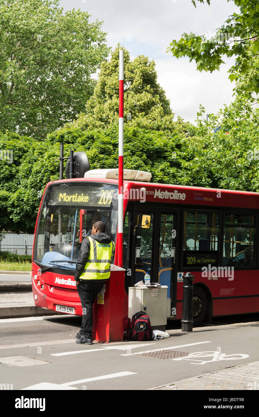 Bus Barrier on the approach road to Hammersmith Bridge, west London, UK ...