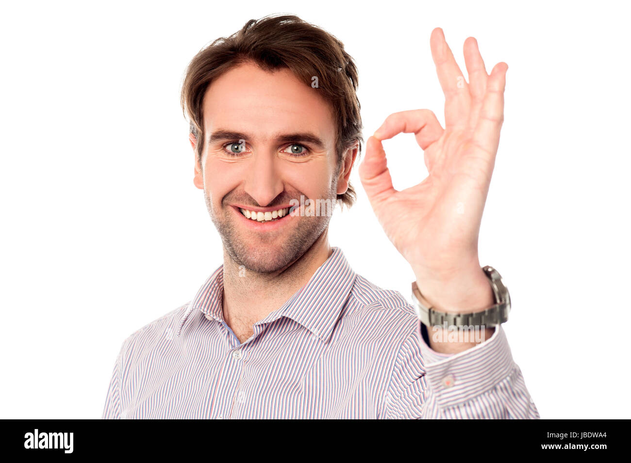Handsome young man showing perfect gesture Stock Photo - Alamy