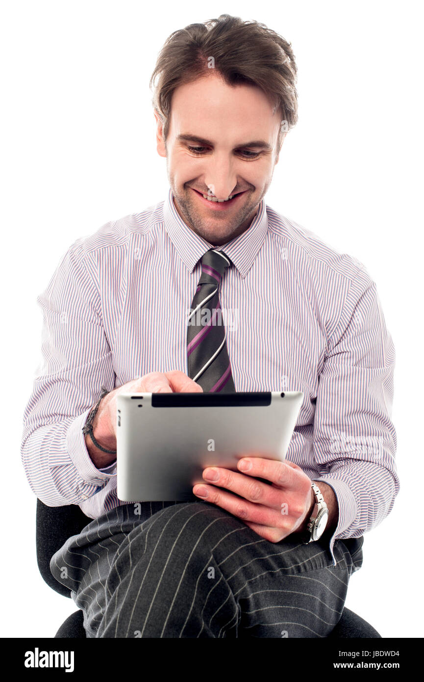Smart business executive operating tablet pc Stock Photo - Alamy