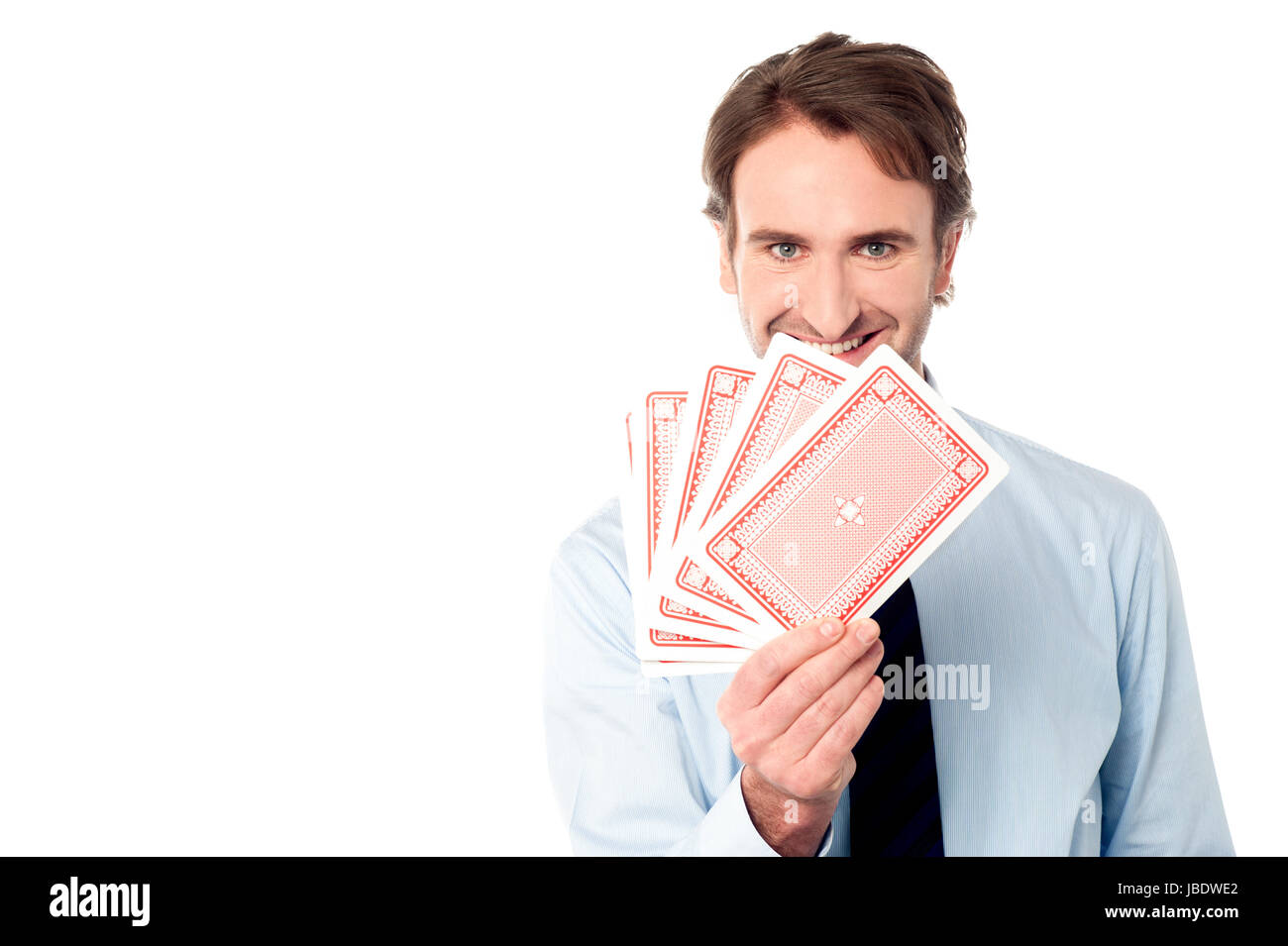Business professional holding playing cards Stock Photo - Alamy