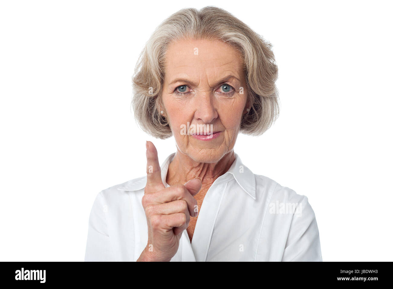 Angry aged woman warning you Stock Photo - Alamy