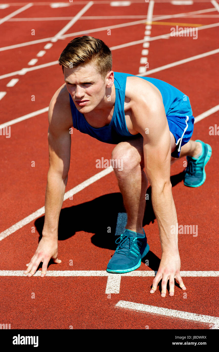 Young male athlete is all set for the big race Stock Photo - Alamy