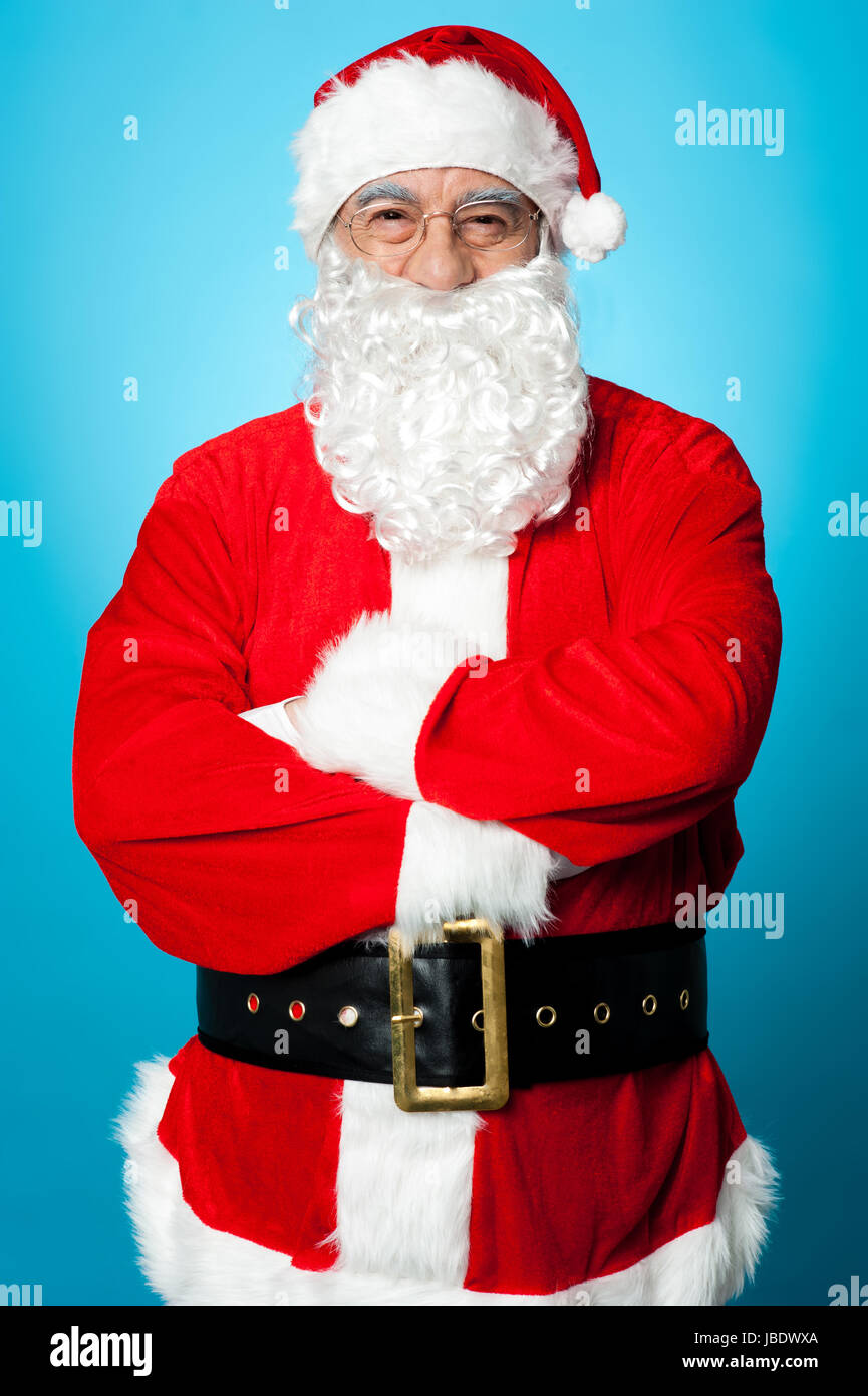 Santa claus posing with crossed arms Stock Photo - Alamy