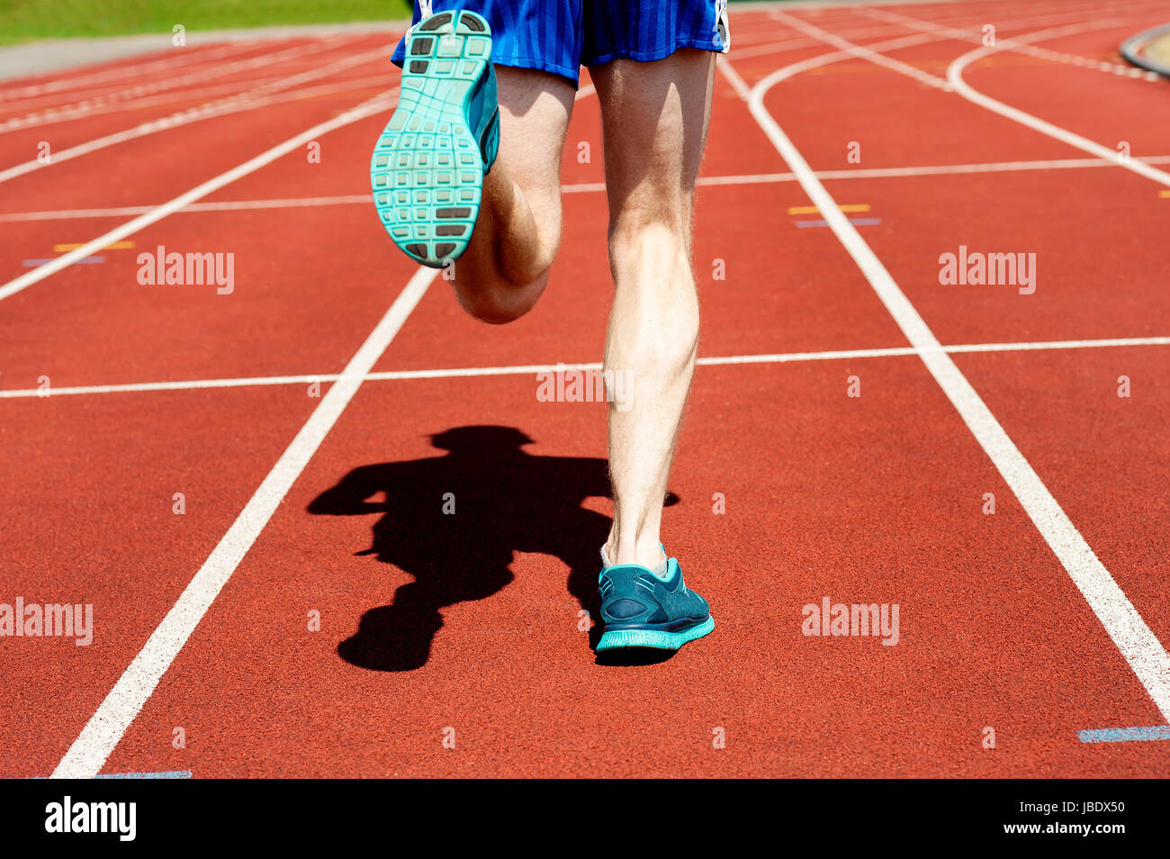 Cropped image of a runner on competitive running Stock Photo - Alamy