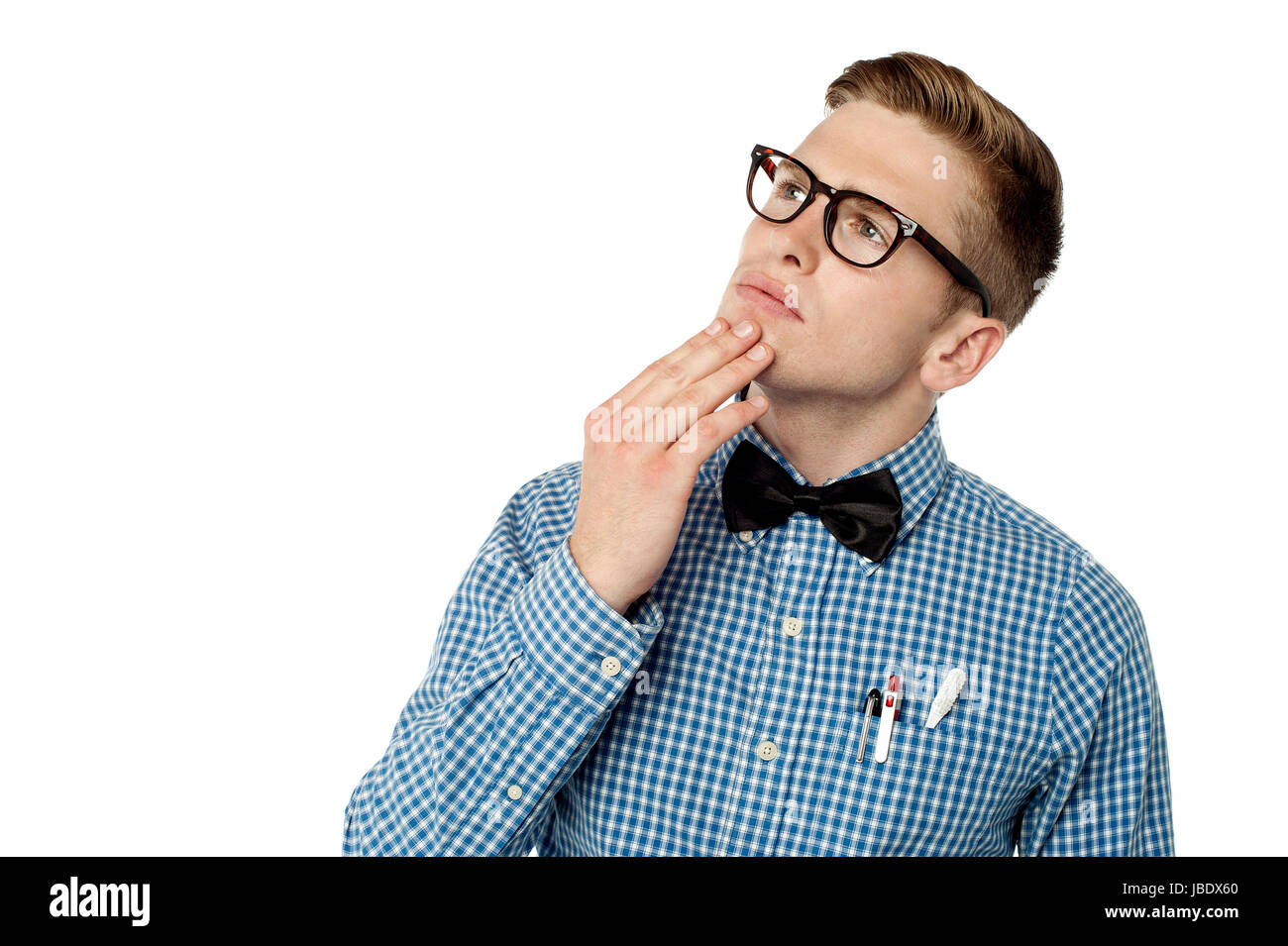 Young serious male nerd thinking of something Stock Photo - Alamy