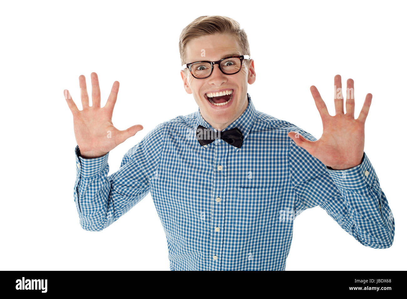 Image of an excited nerd with open palms over white Stock Photo - Alamy