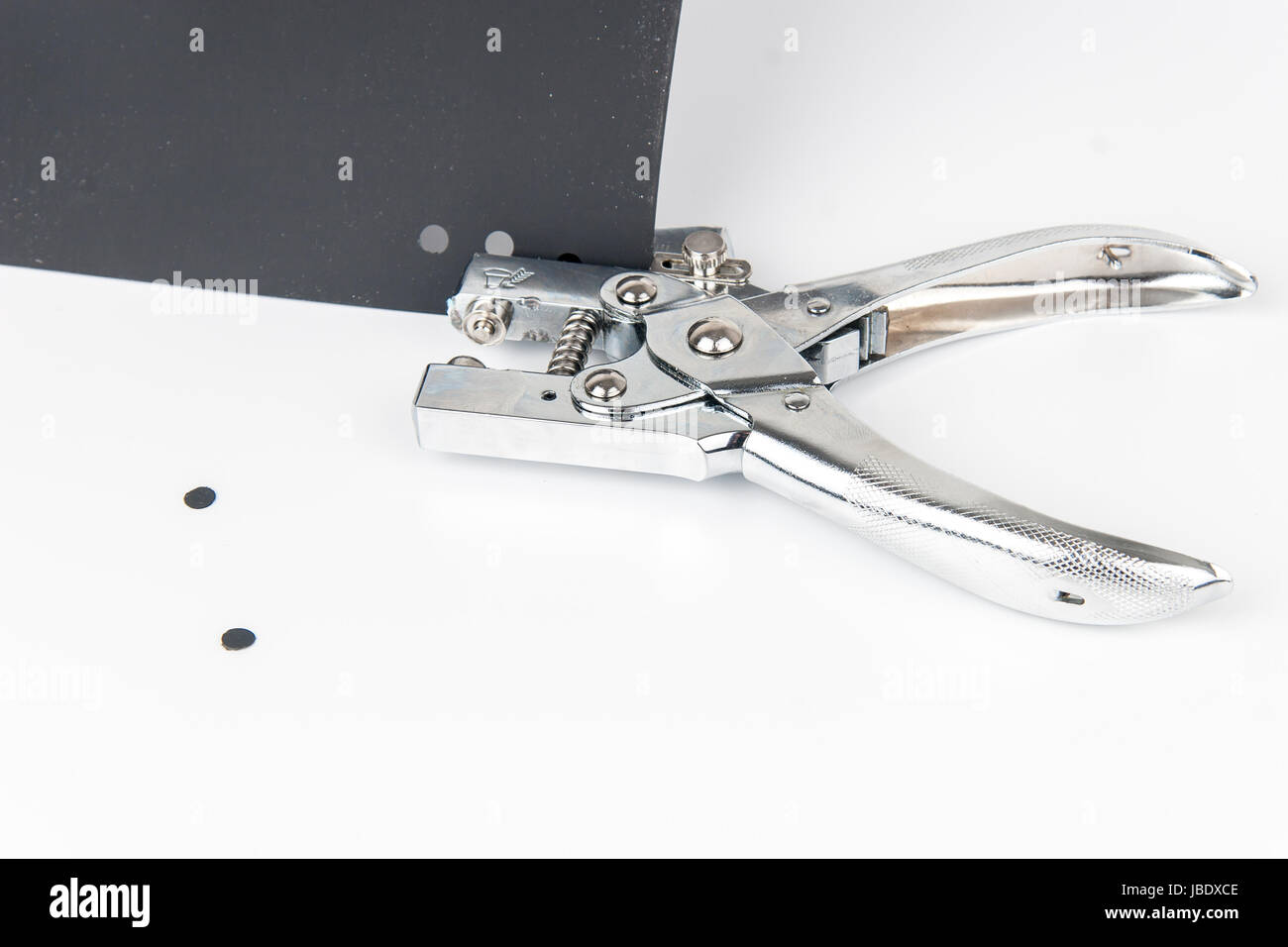 Office Puncher Unit isolated on white background Stock Photo - Alamy