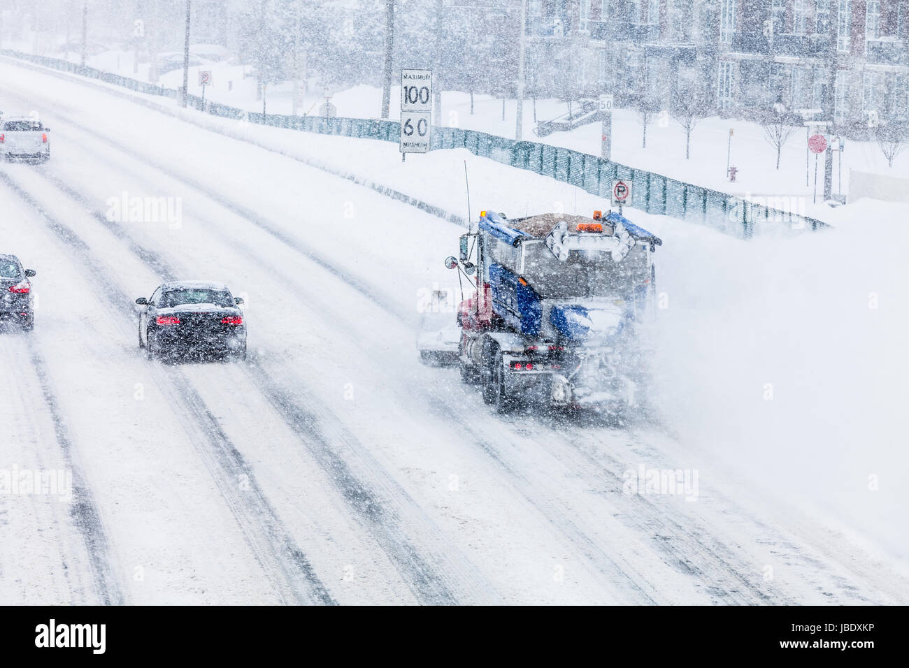 Snowplow Truck Removing the Snow from the Highway during a Cold ...