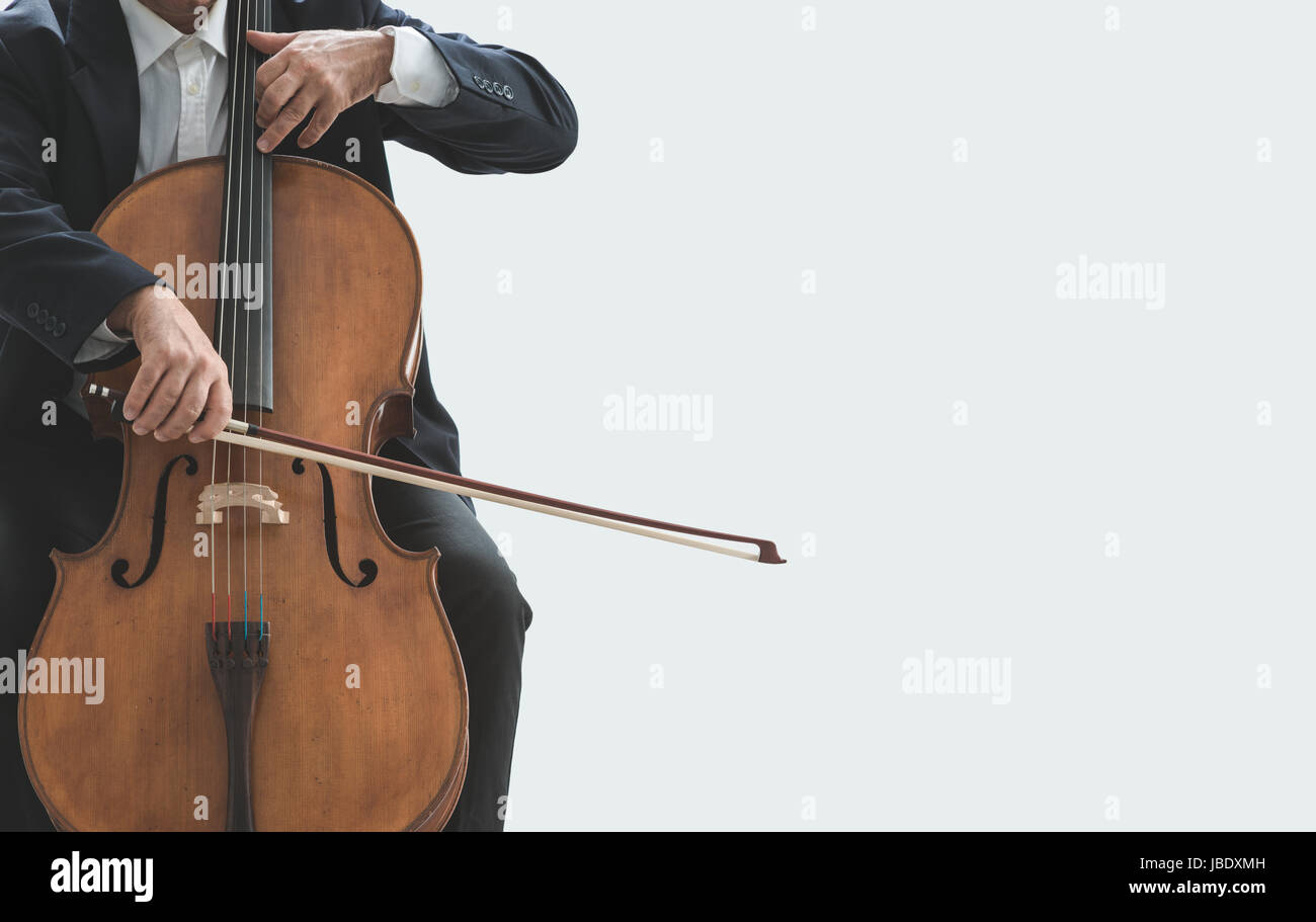 Professional male cellist playing his cello, classical music solo ...
