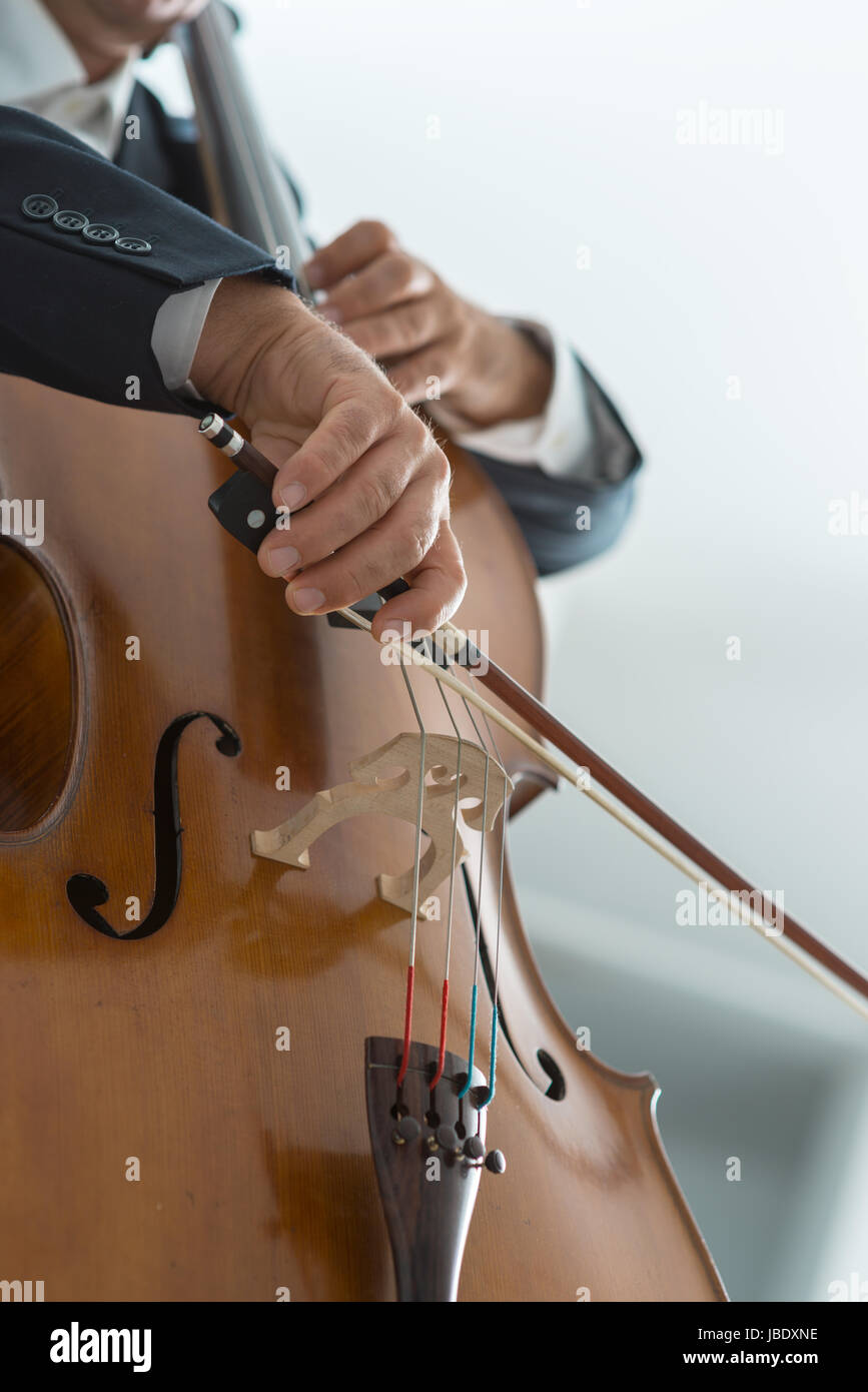 Classical music professional cello player solo performance, hands close ...