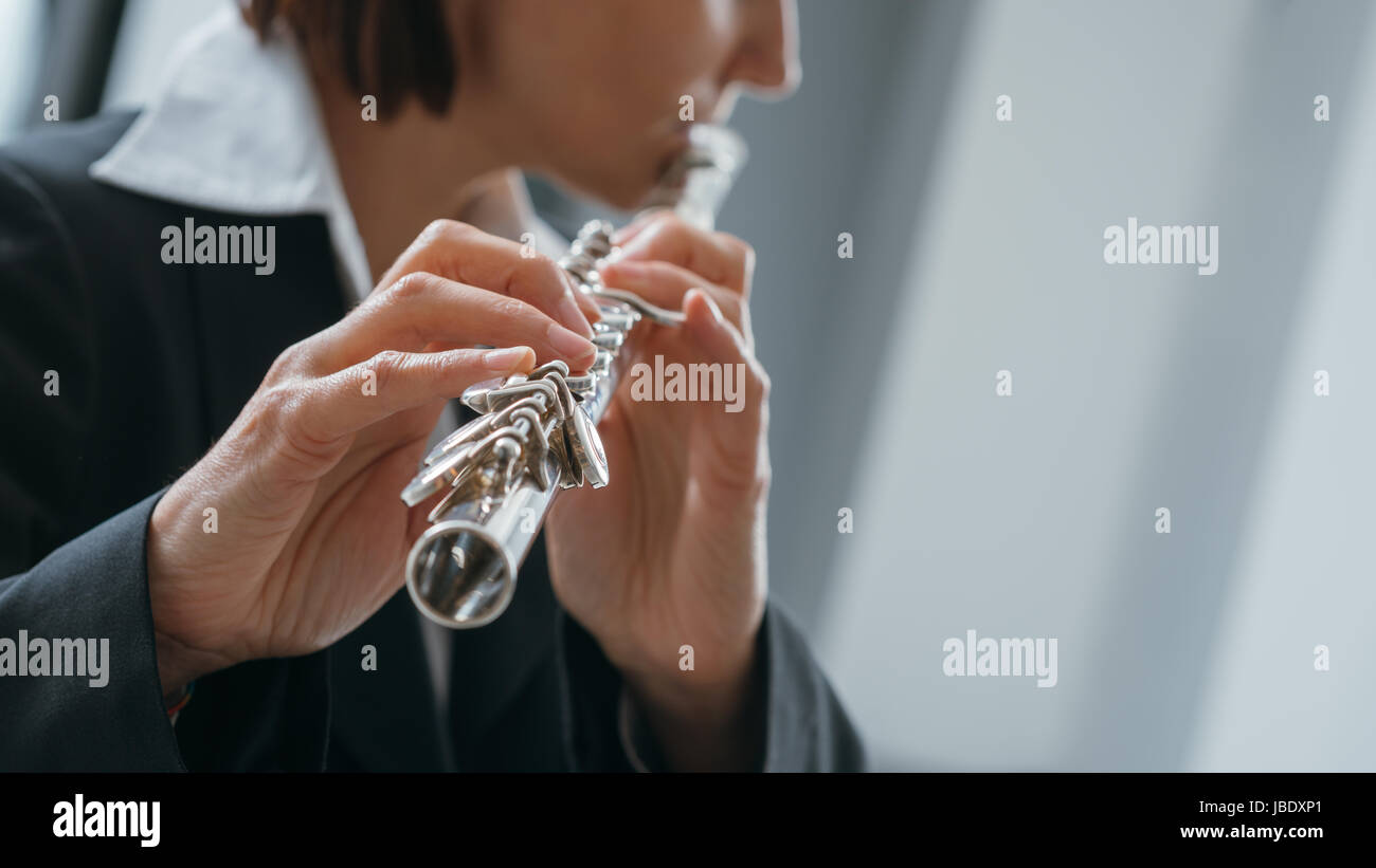 Professional female flutist in concert hi-res stock photography and ...