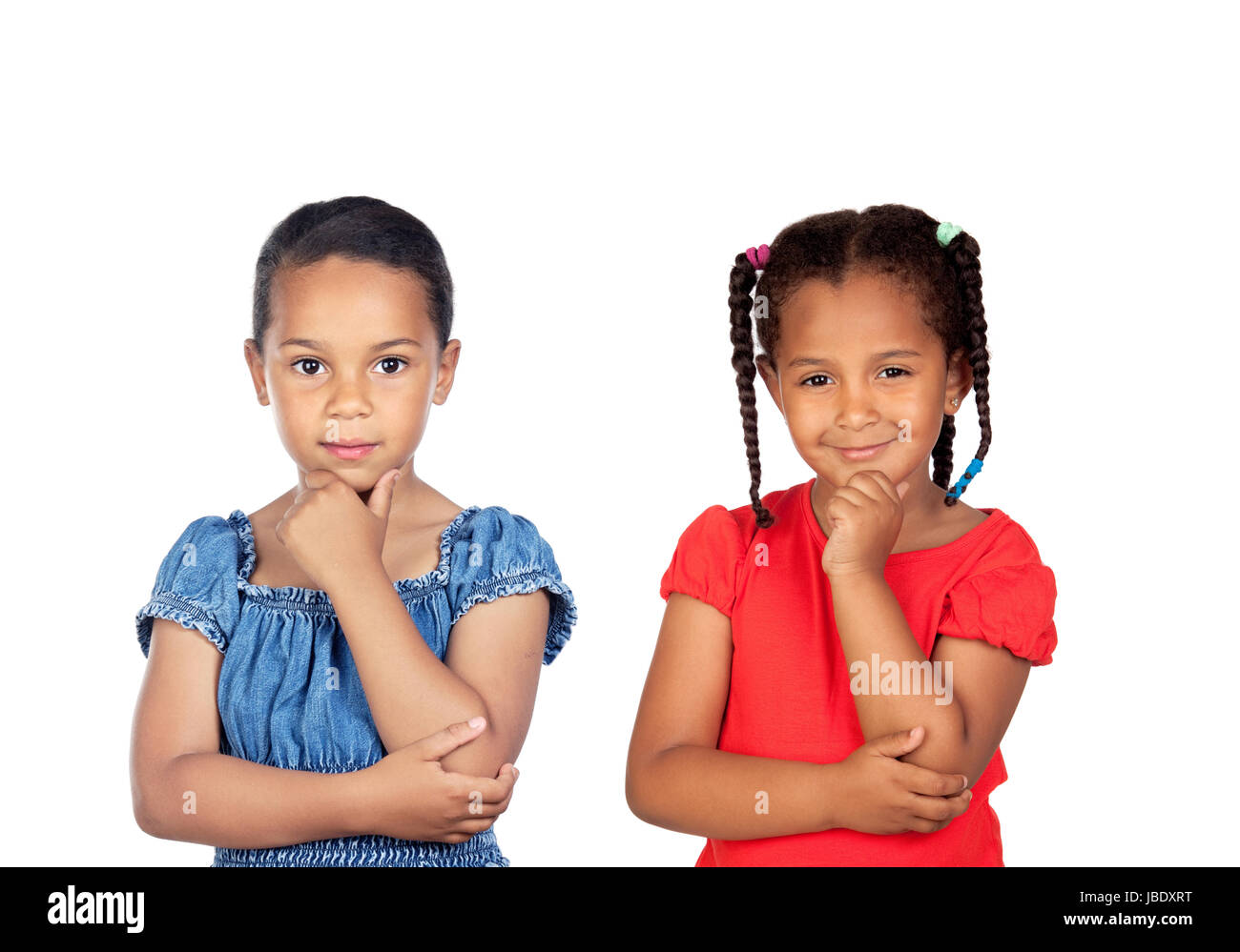 Two beautiful little girls thinking isolated on a white background ...
