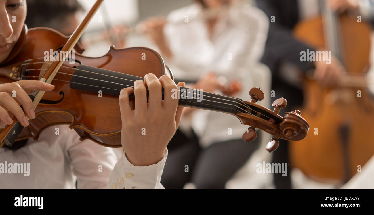 Classical music symphony orchestra string section performing, female ...
