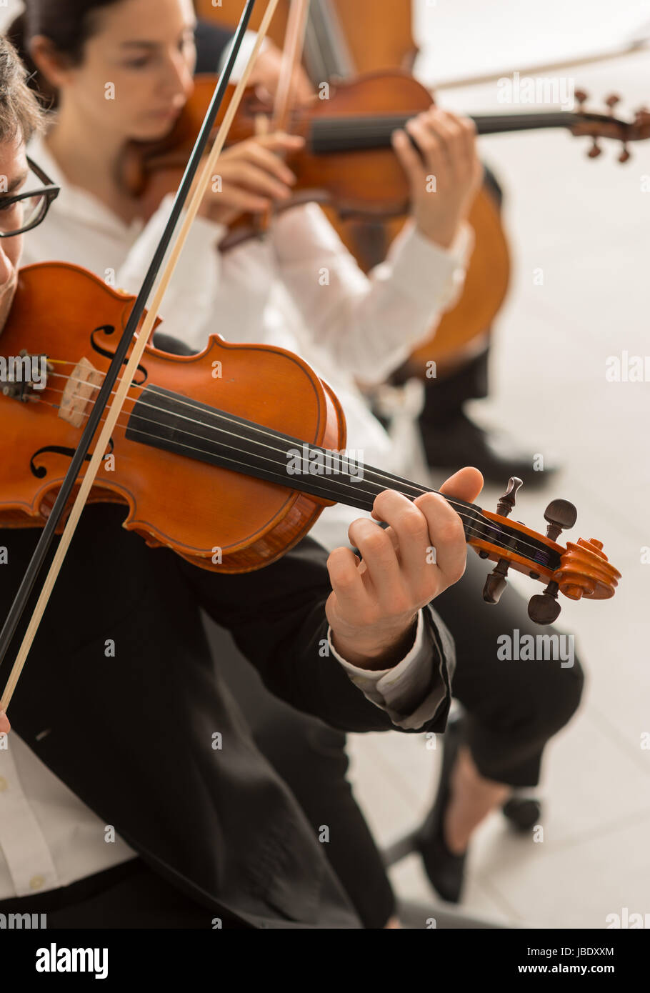 Classical music symphony orchestra string section performing, male ...