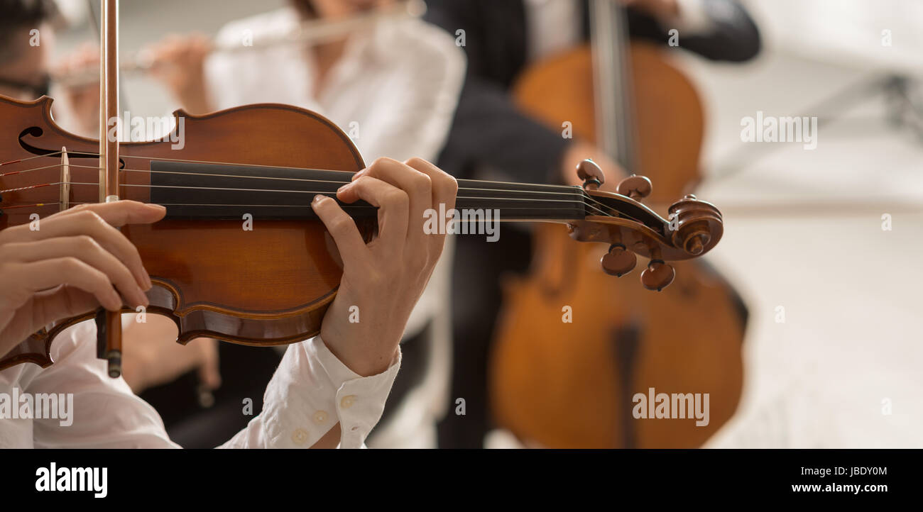 Classical music symphony orchestra string section performing, female ...