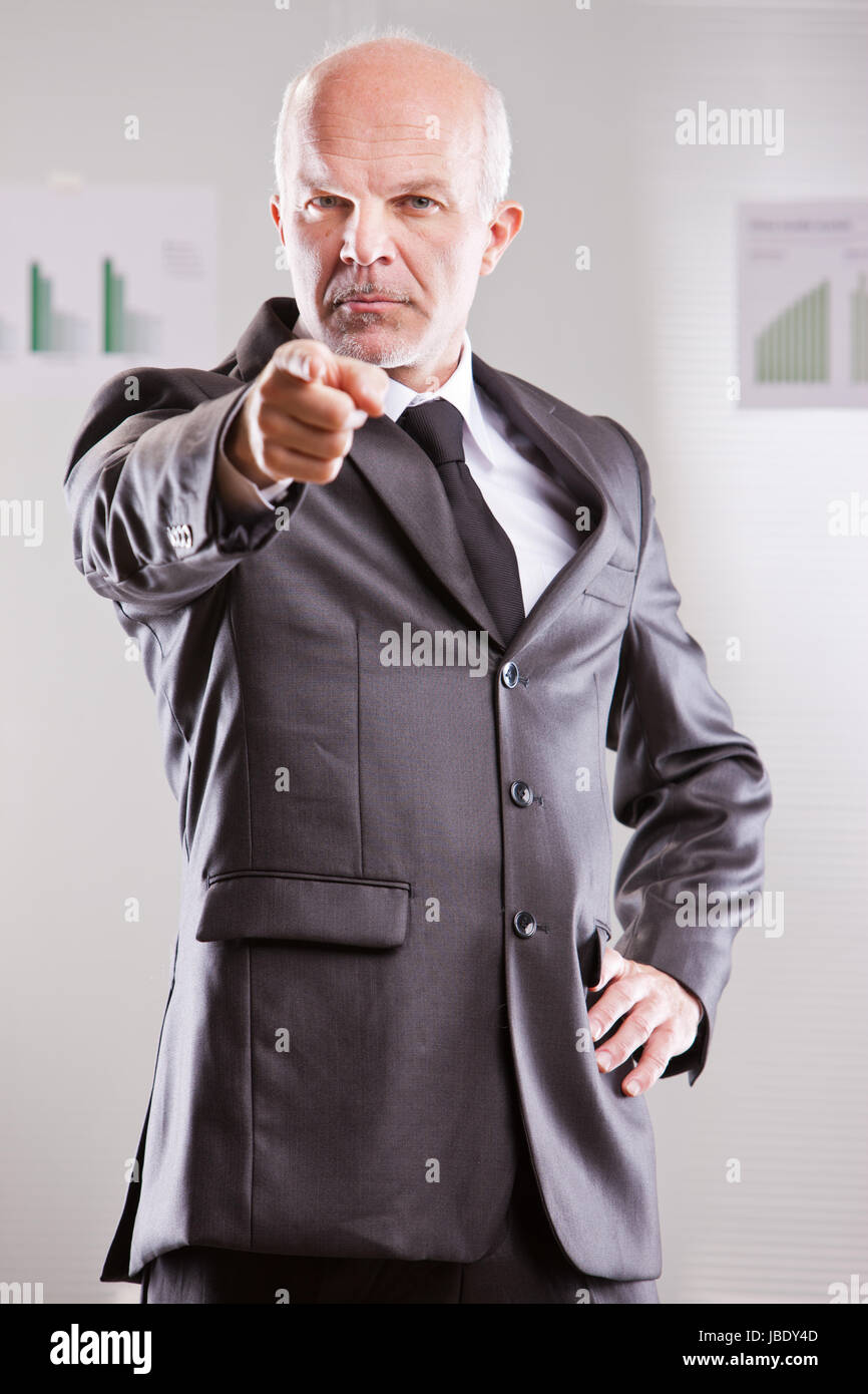 businessman pointing at you with an extremely serious expression Stock ...