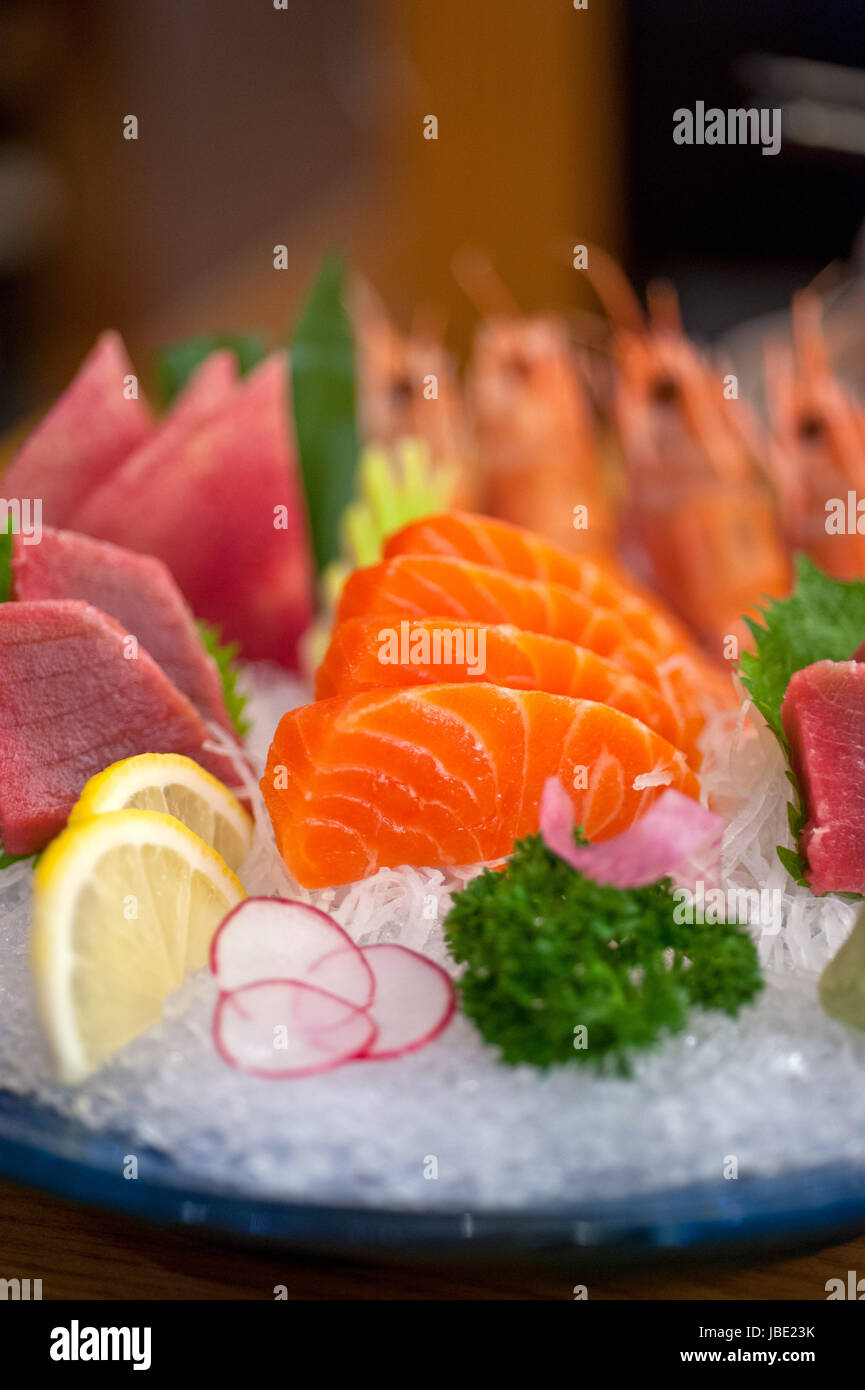 Japanese style assorted sashimi dish laid over crushed ice Stock Photo ...