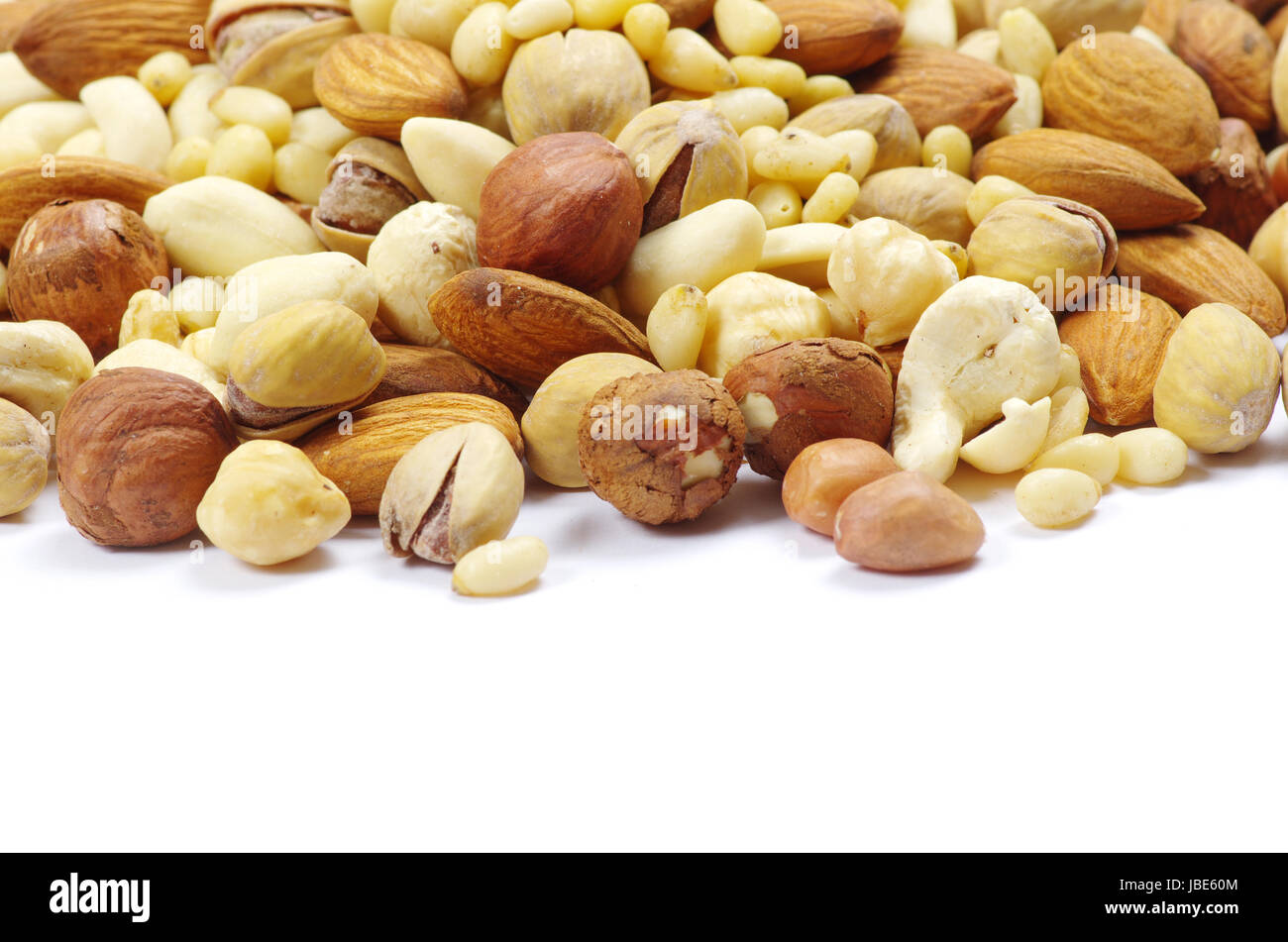 Assorted mixed nuts on white background Stock Photo - Alamy