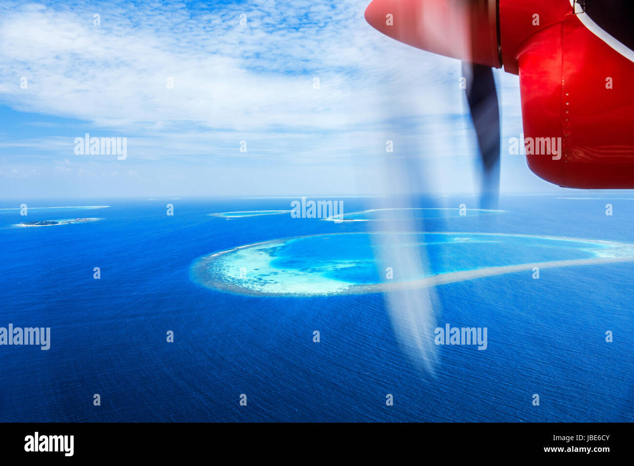 Luxury holidays, flight to resort on a little red water airplane ...