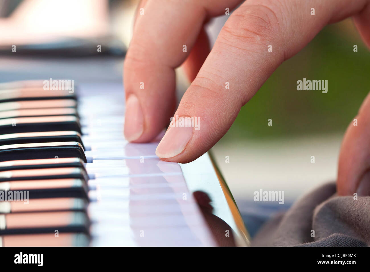 Close-up of hand playing the electric organ Stock Photo - Alamy