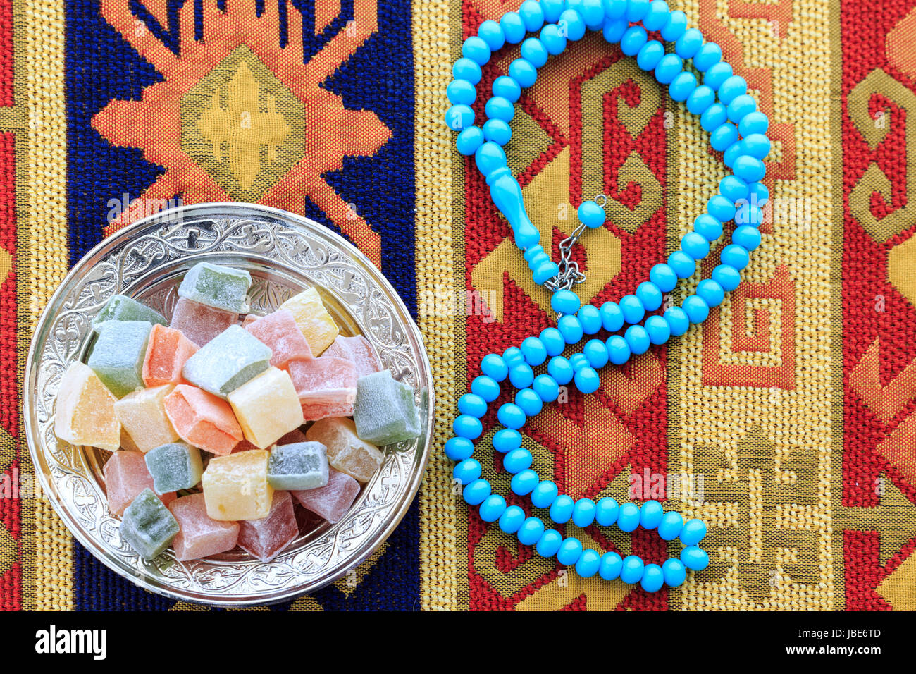 Turkish delights and blue rosary on traditional turkish carpet Stock ...