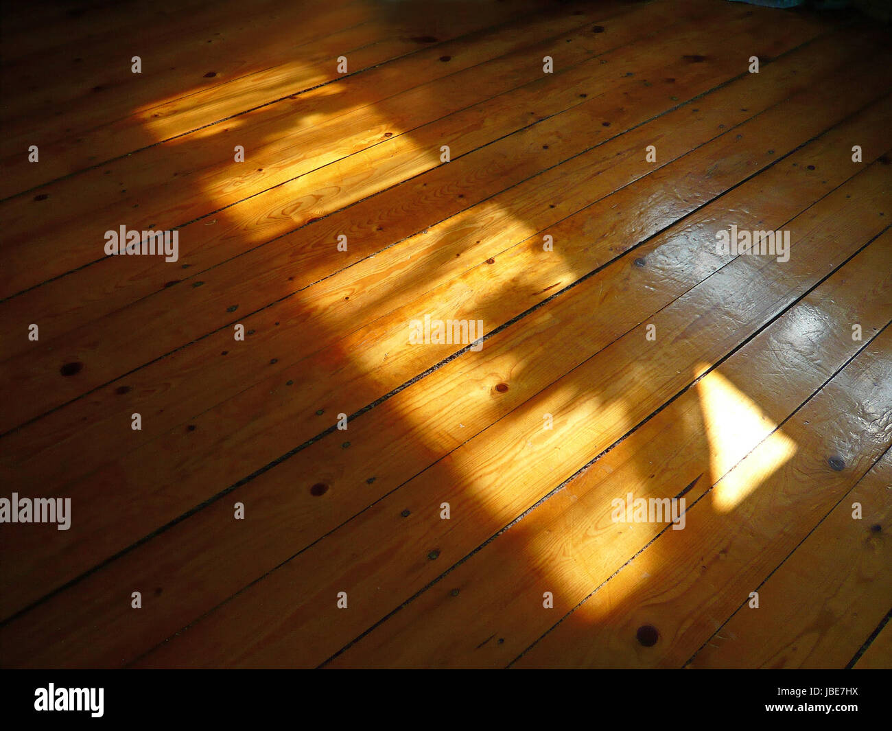Sun rays on wooden floor Stock Photo - Alamy