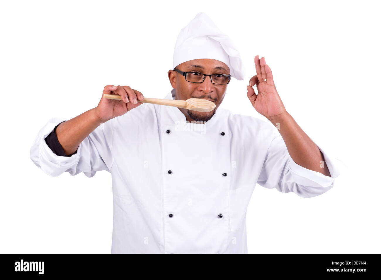 Male chef with wooden spoon isolated on white background Stock Photo ...