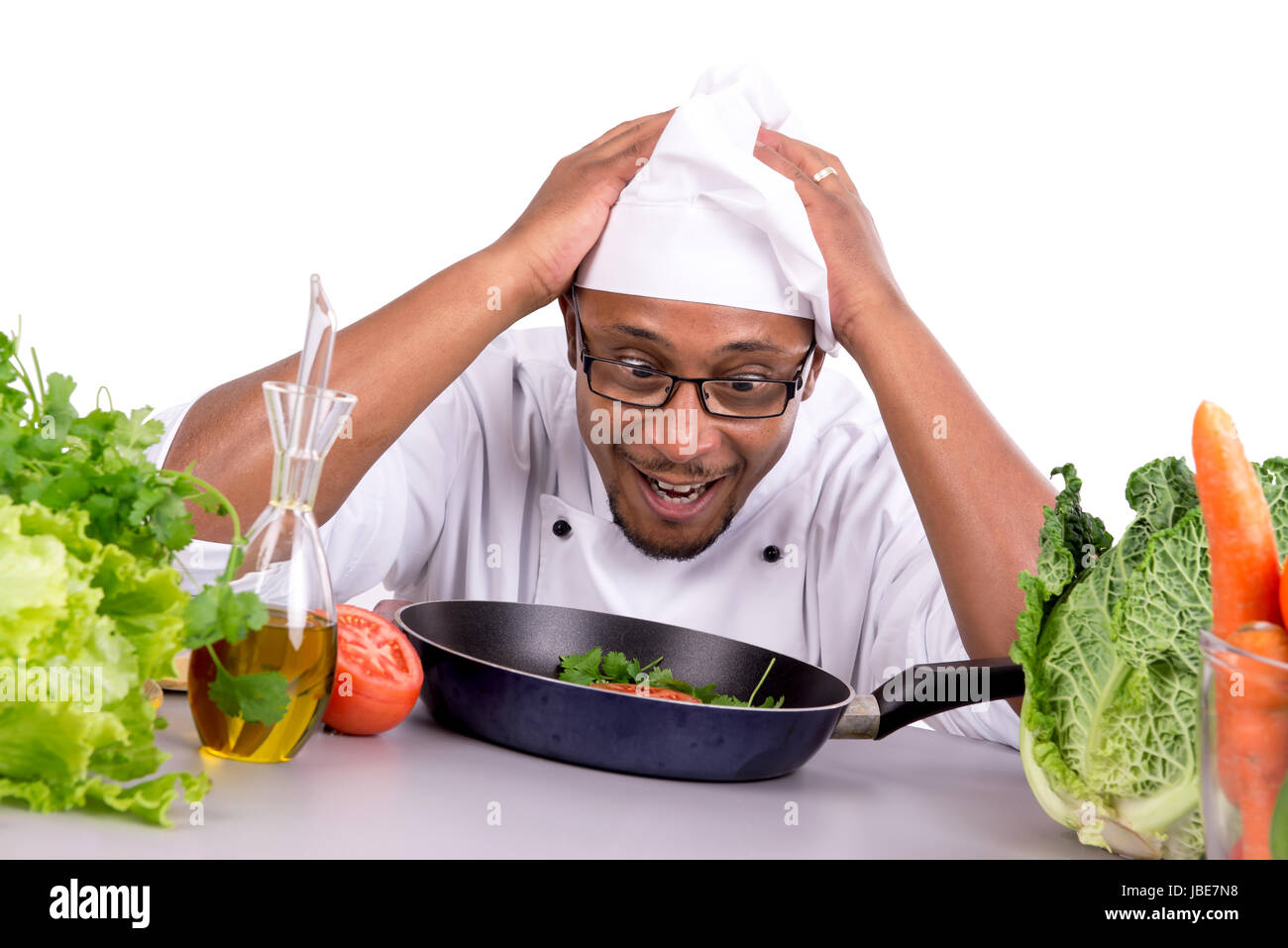 Desperate male chef with fruits and vegetables cooking Stock Photo - Alamy
