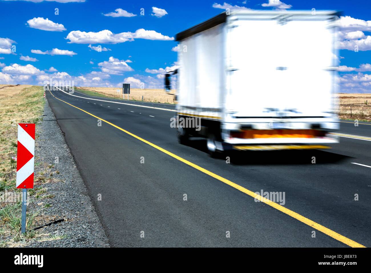 Big transporter truck travelling along the highway at speed Stock Photo ...