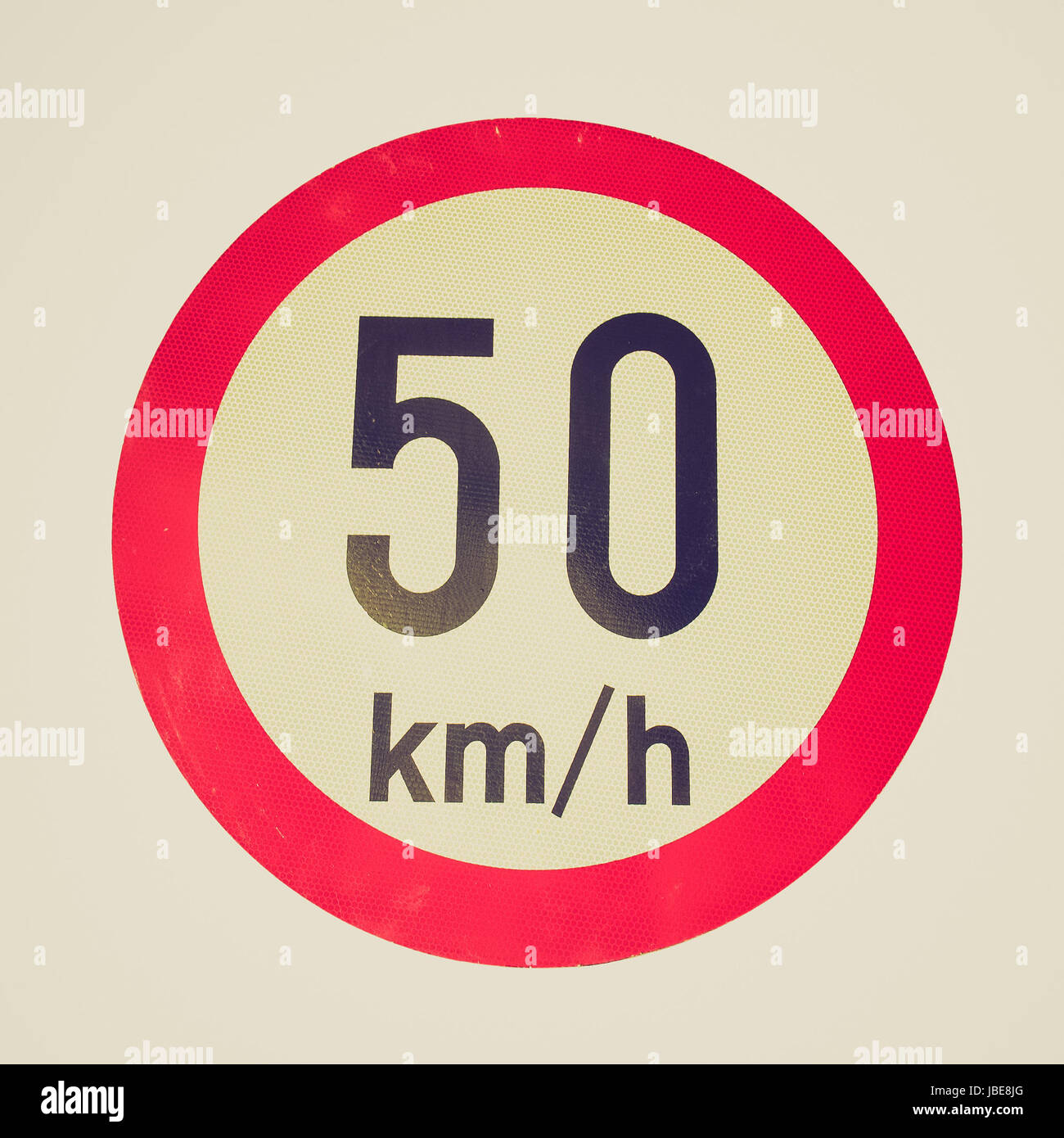 Vintage retro looking Traffic speed limit sign isolated over white ...