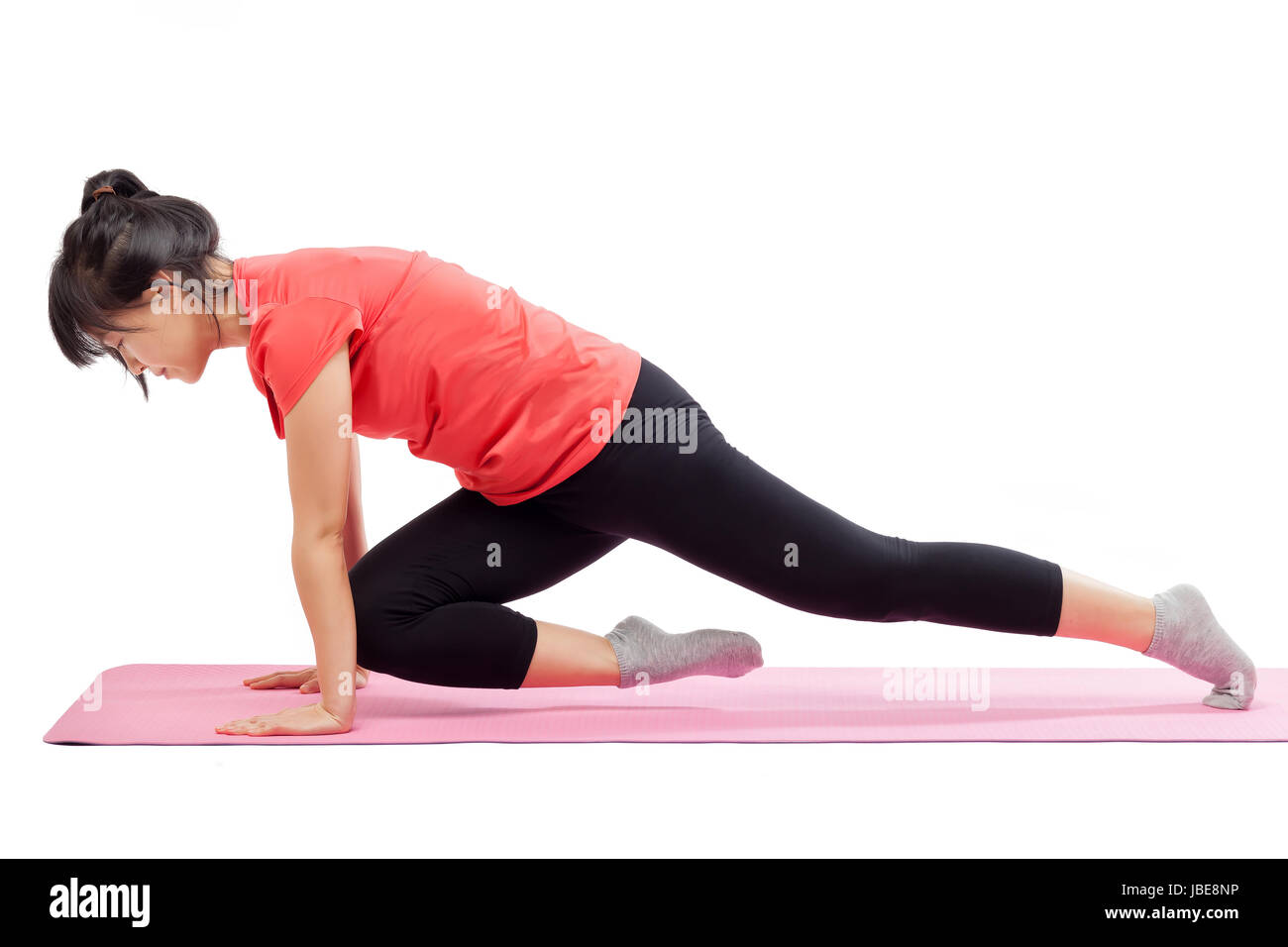 Woman exercising isolated on white background Stock Photo - Alamy