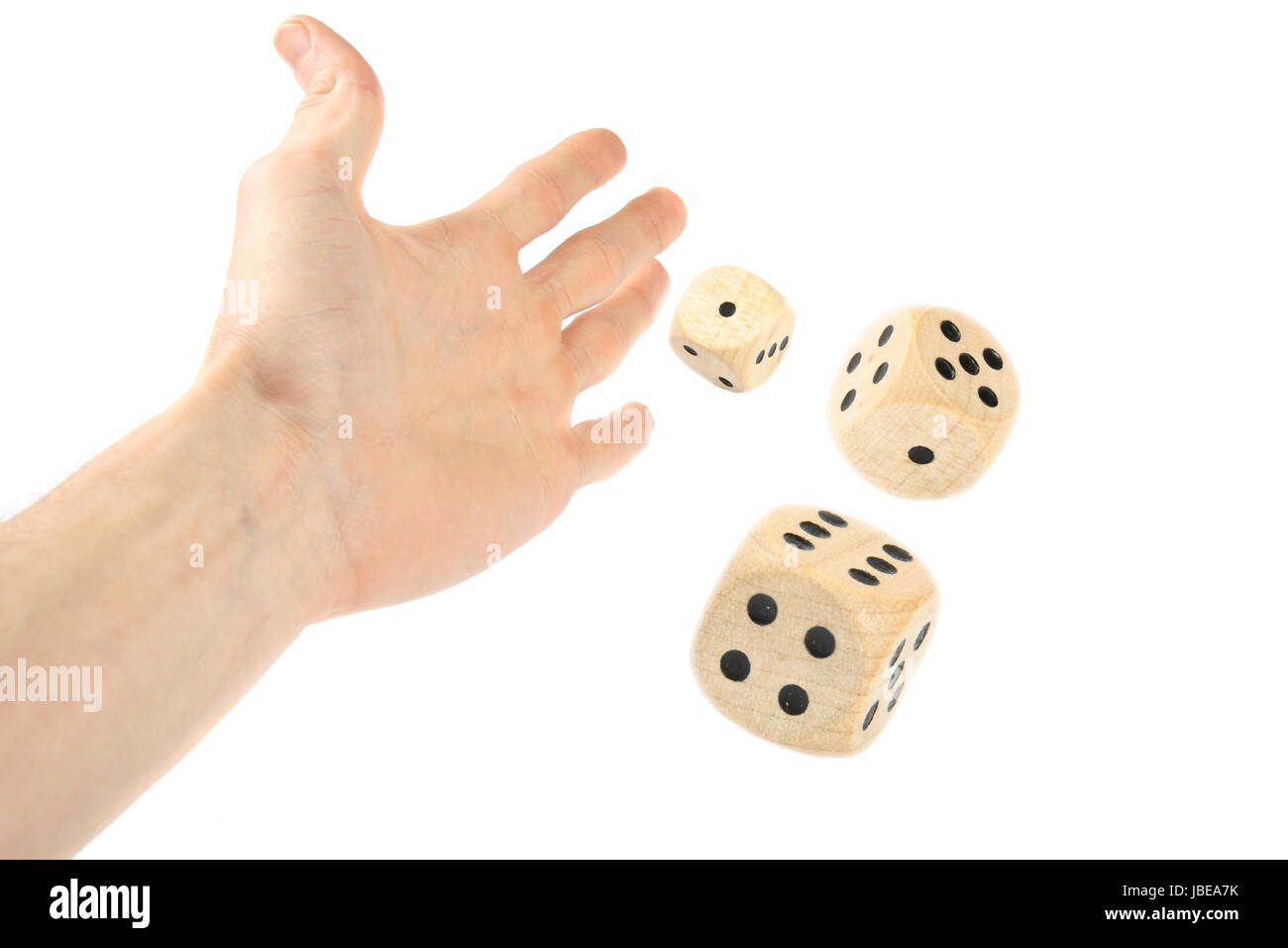 Hand throwing dice Stock Photo - Alamy