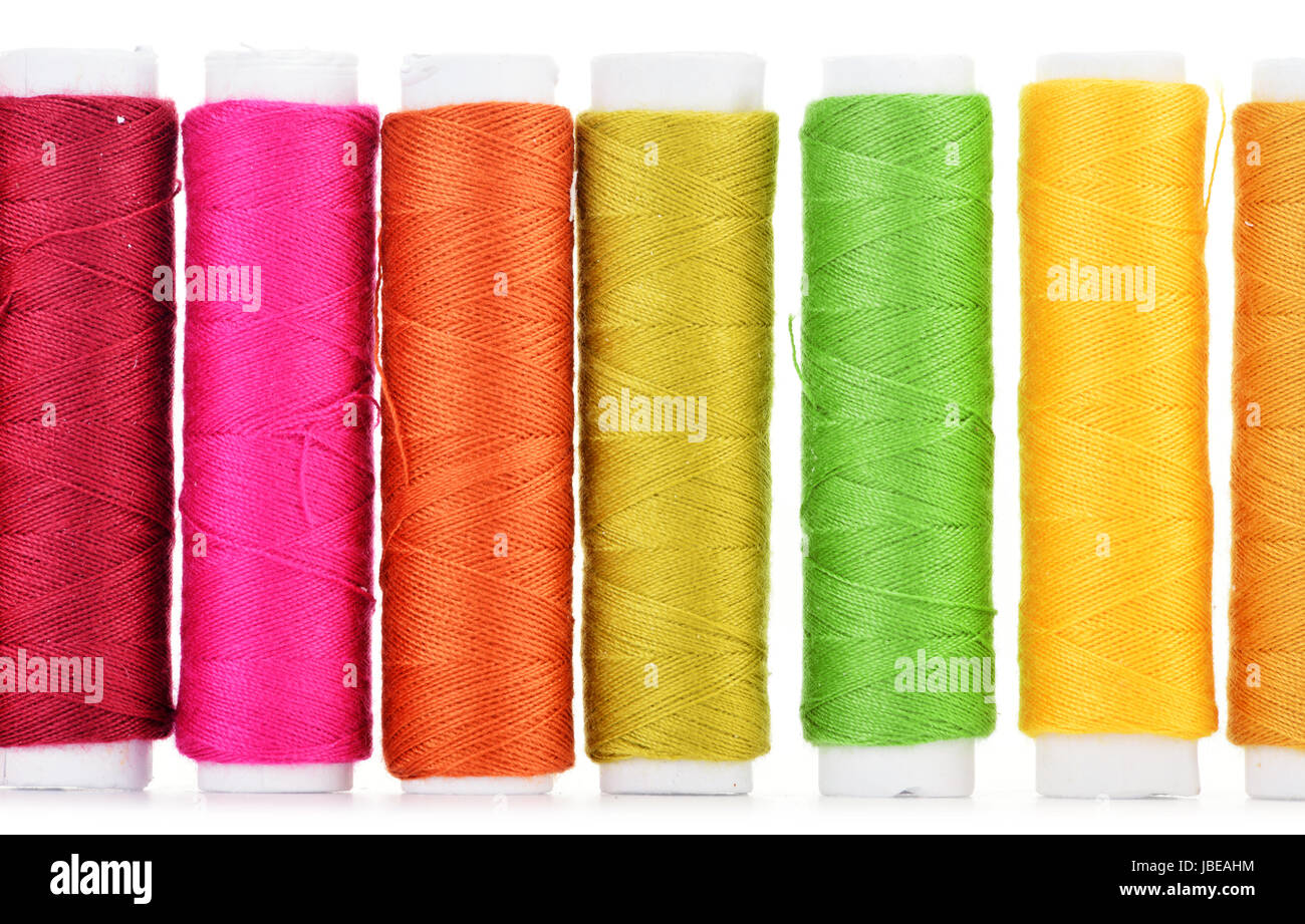 Composition with tailor threads over white background Stock Photo - Alamy