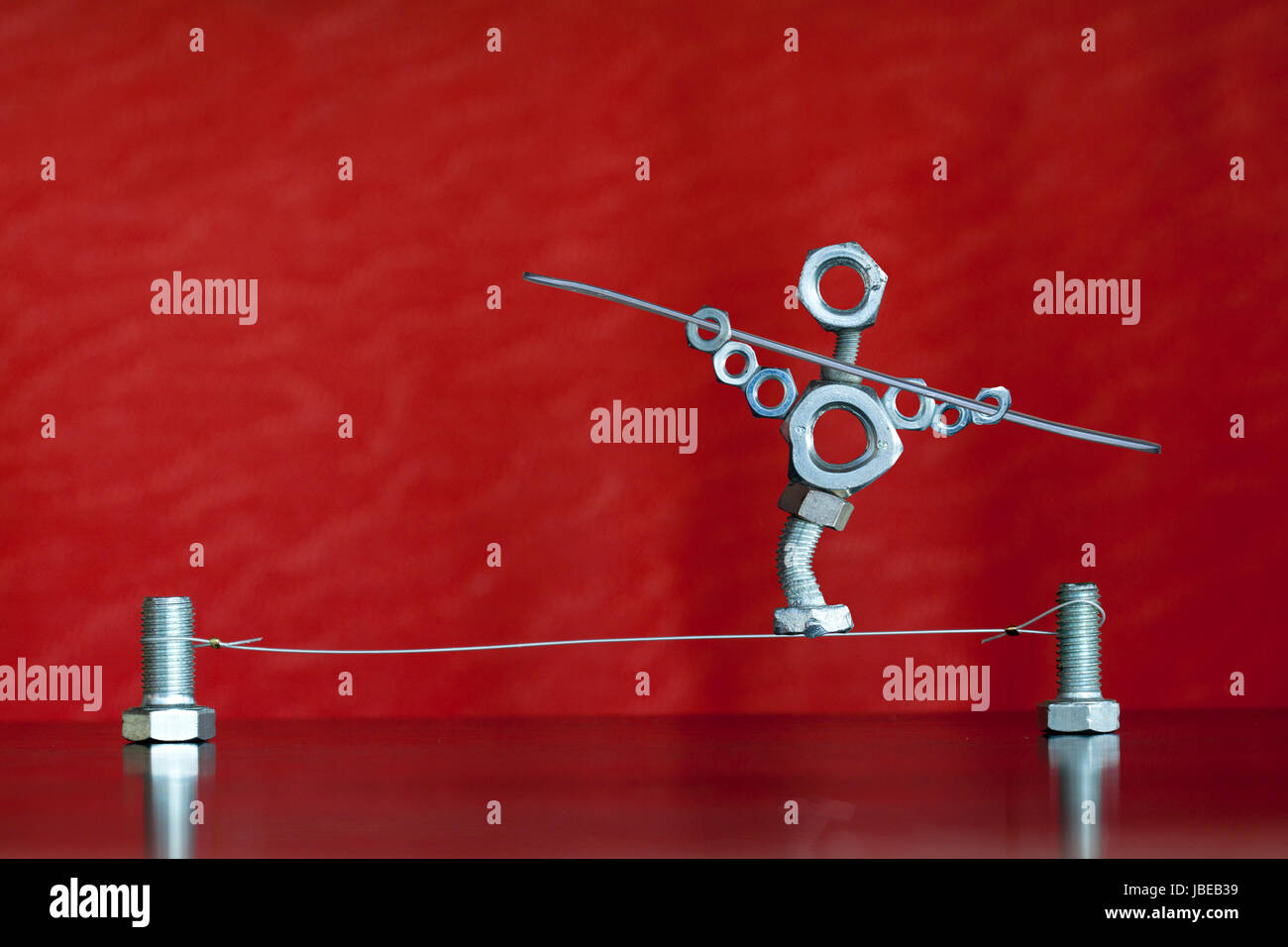 miss groove as a tightrope walker with pole Stock Photo - Alamy