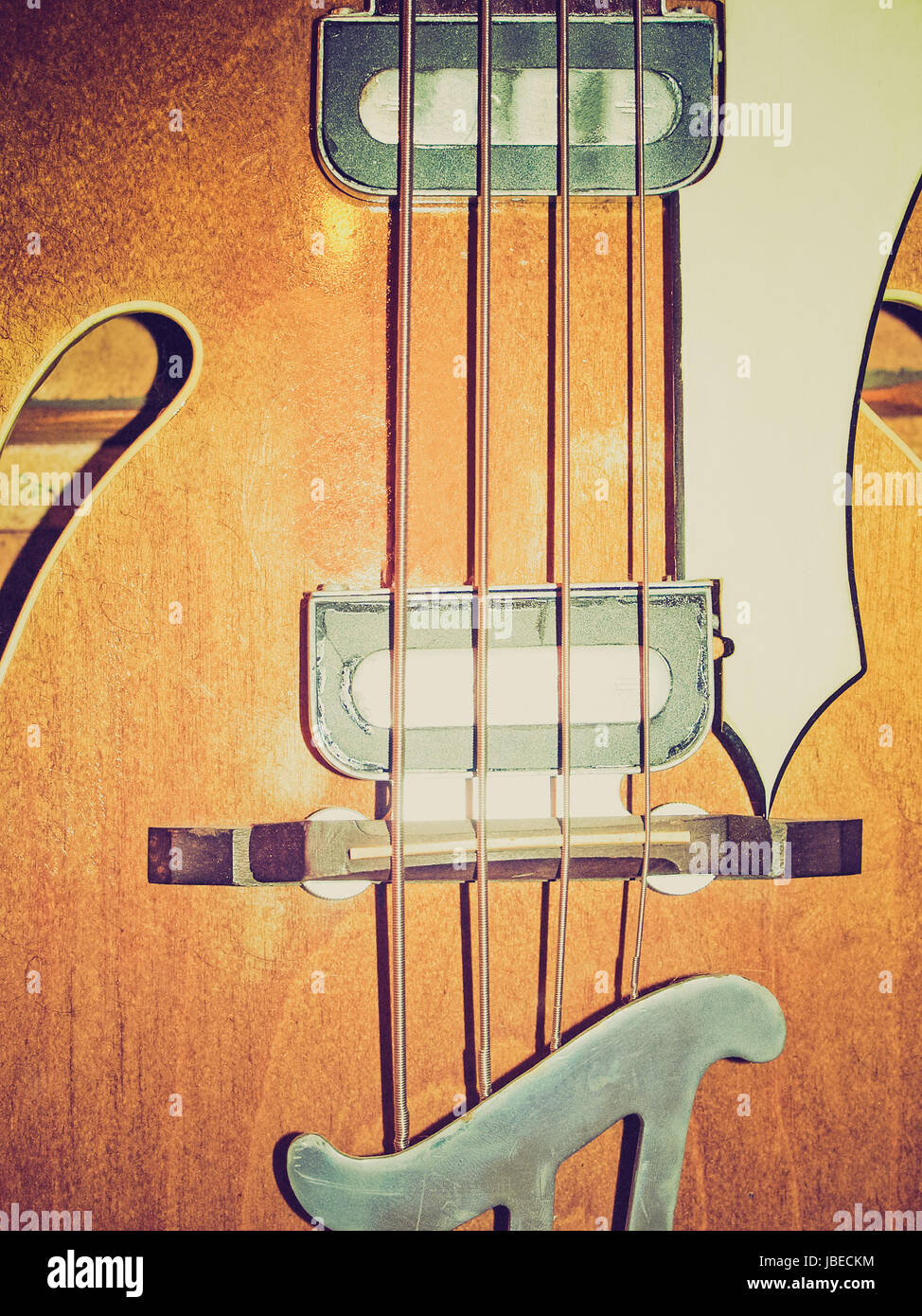 Vintage retro looking Detail of 4 string bass guitar Stock Photo - Alamy