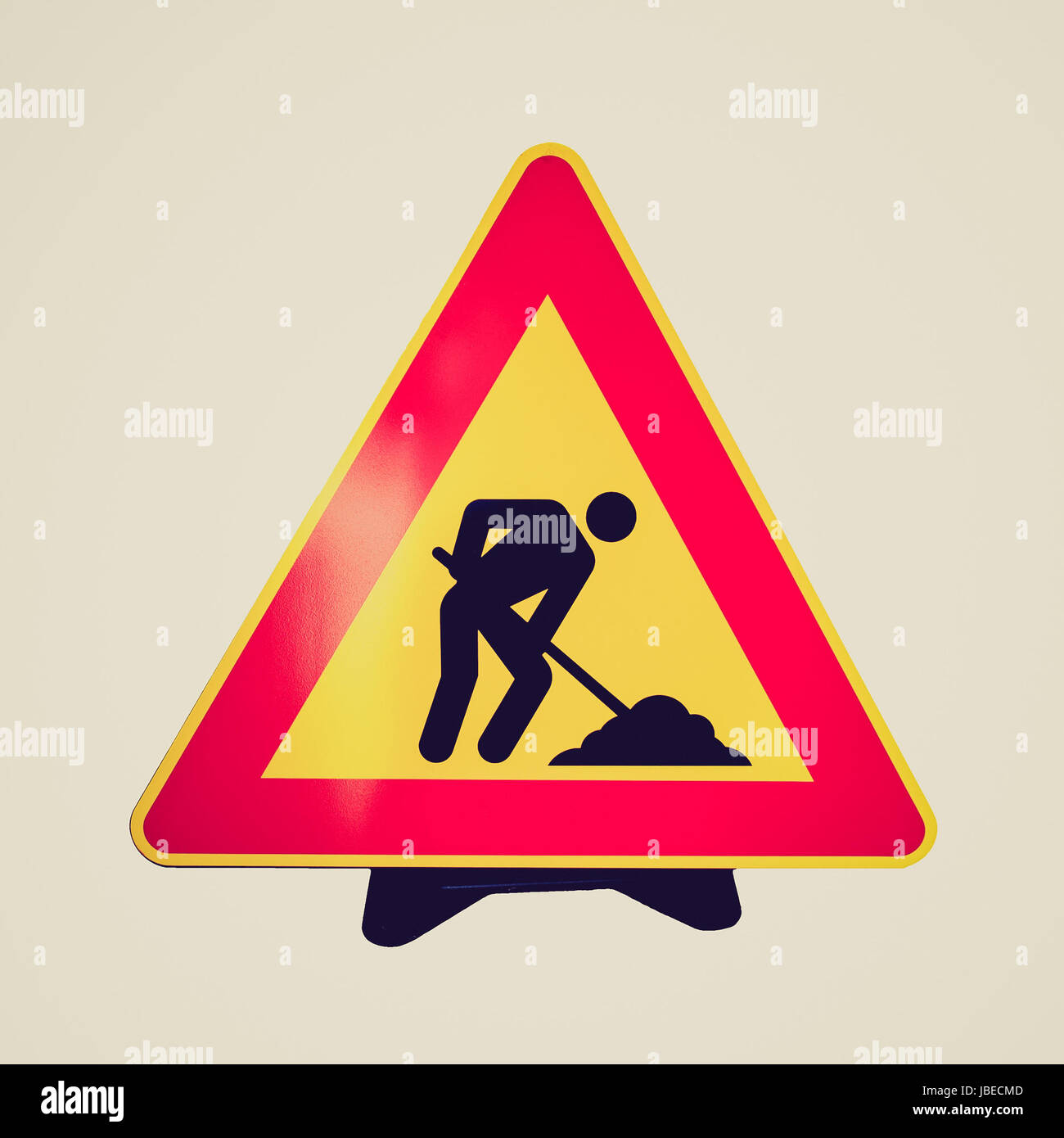 Vintage retro looking Road work sign isolated over a white background ...