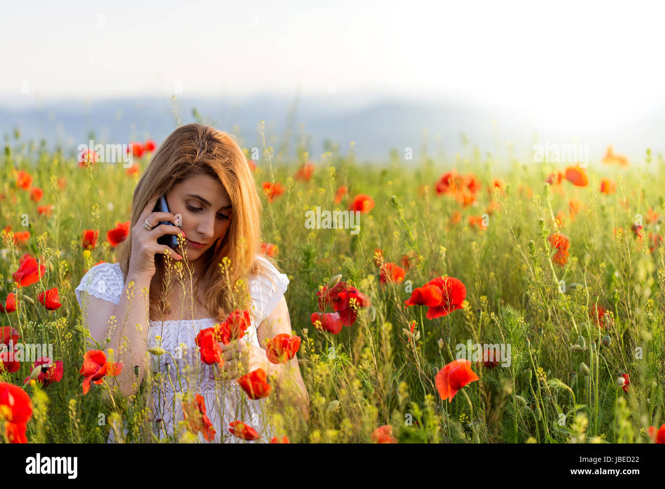 Sad Girl In Field Of Flowers
