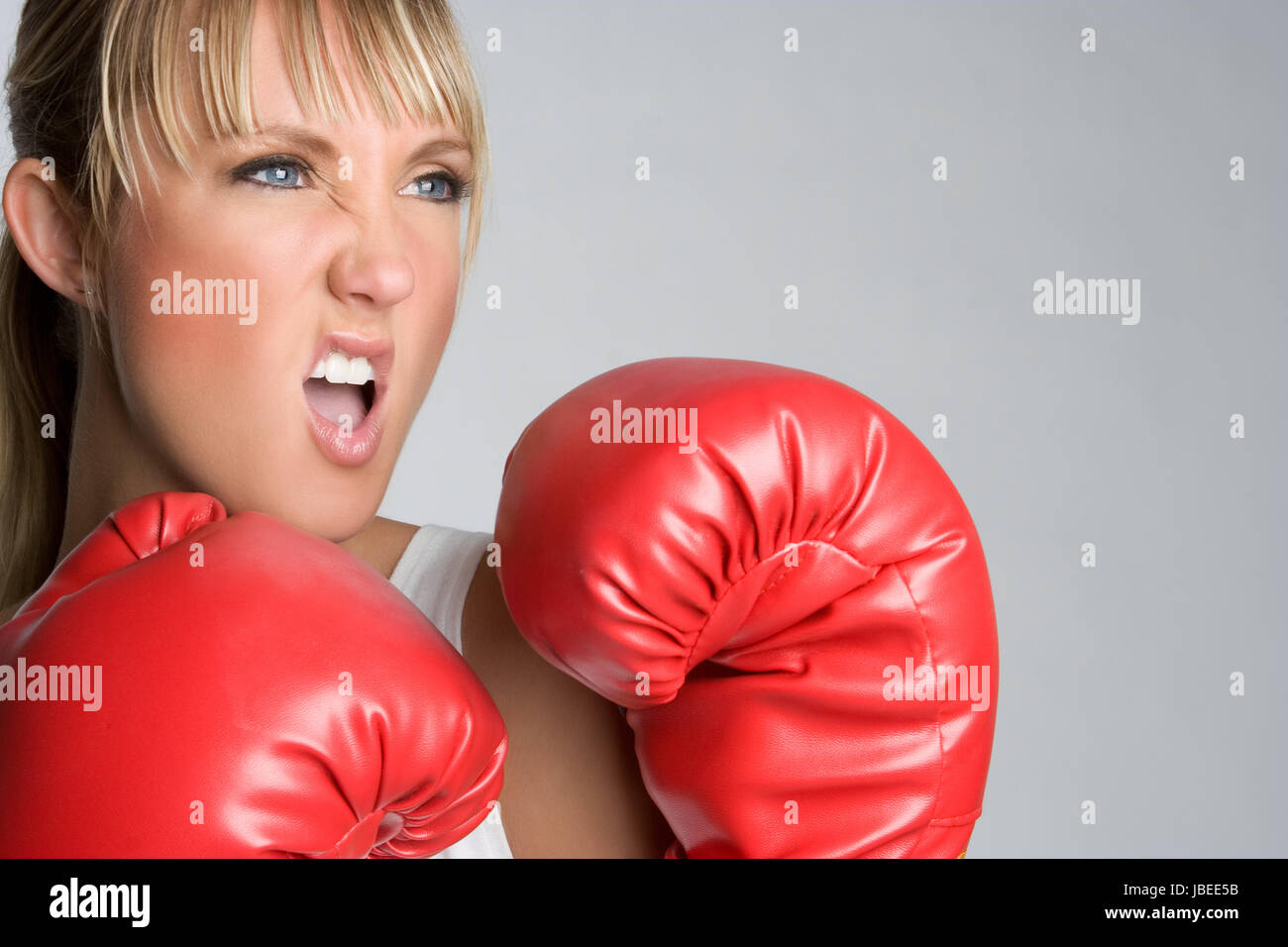Beautiful aggressive blond female boxer Stock Photo - Alamy