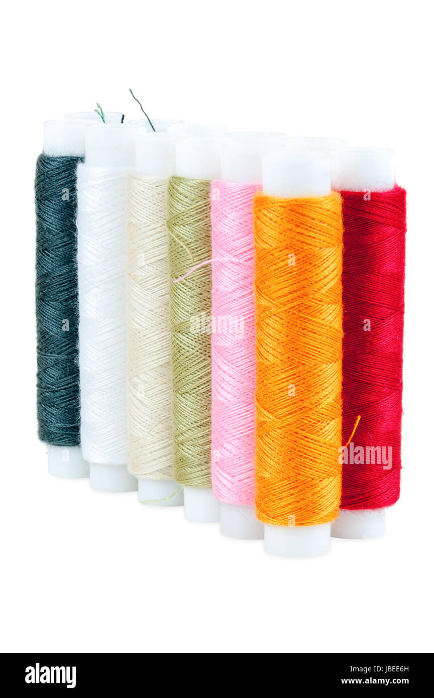 Colored spools of threads isolated on white background Stock Photo - Alamy