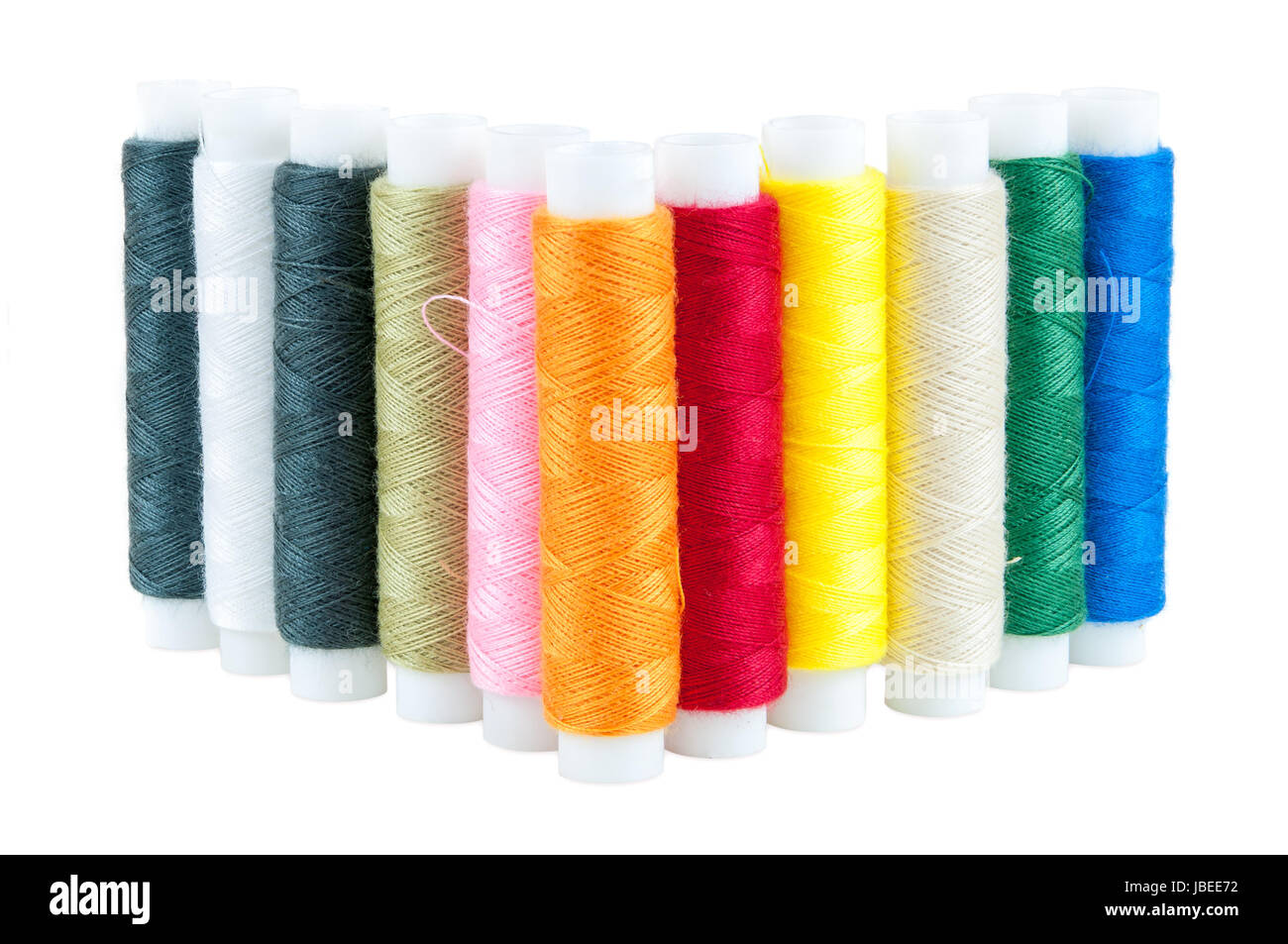 Colored spools of threads isolated on white background Stock Photo - Alamy