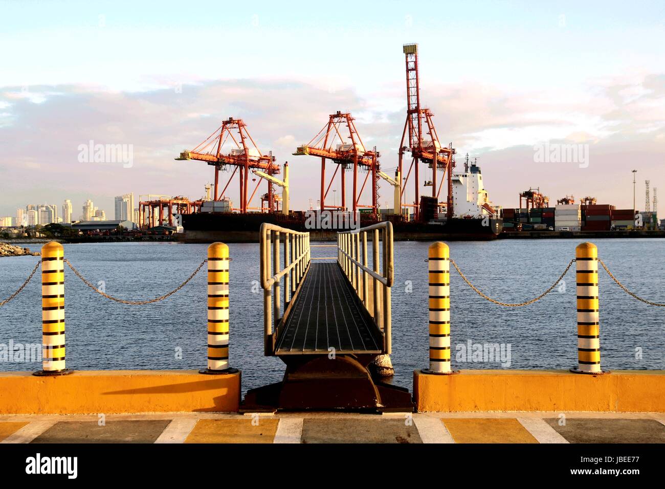 MANILA CITY, PHILIPPINES - January 26, 2016: Loading cranes and a pier ...