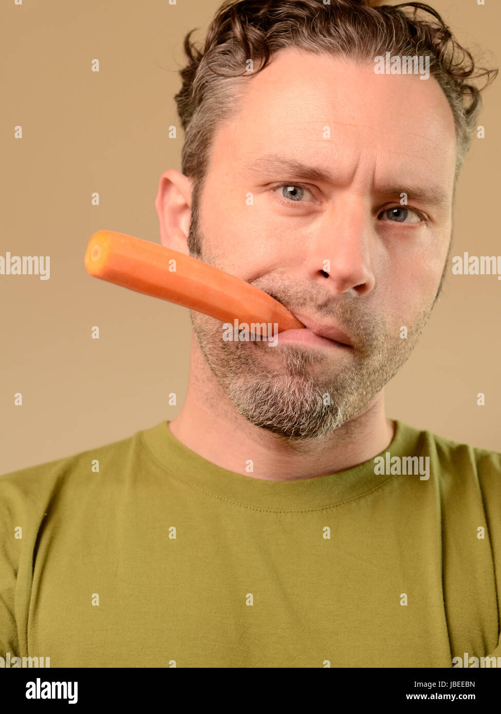 Man with a carrot Stock Photo - Alamy